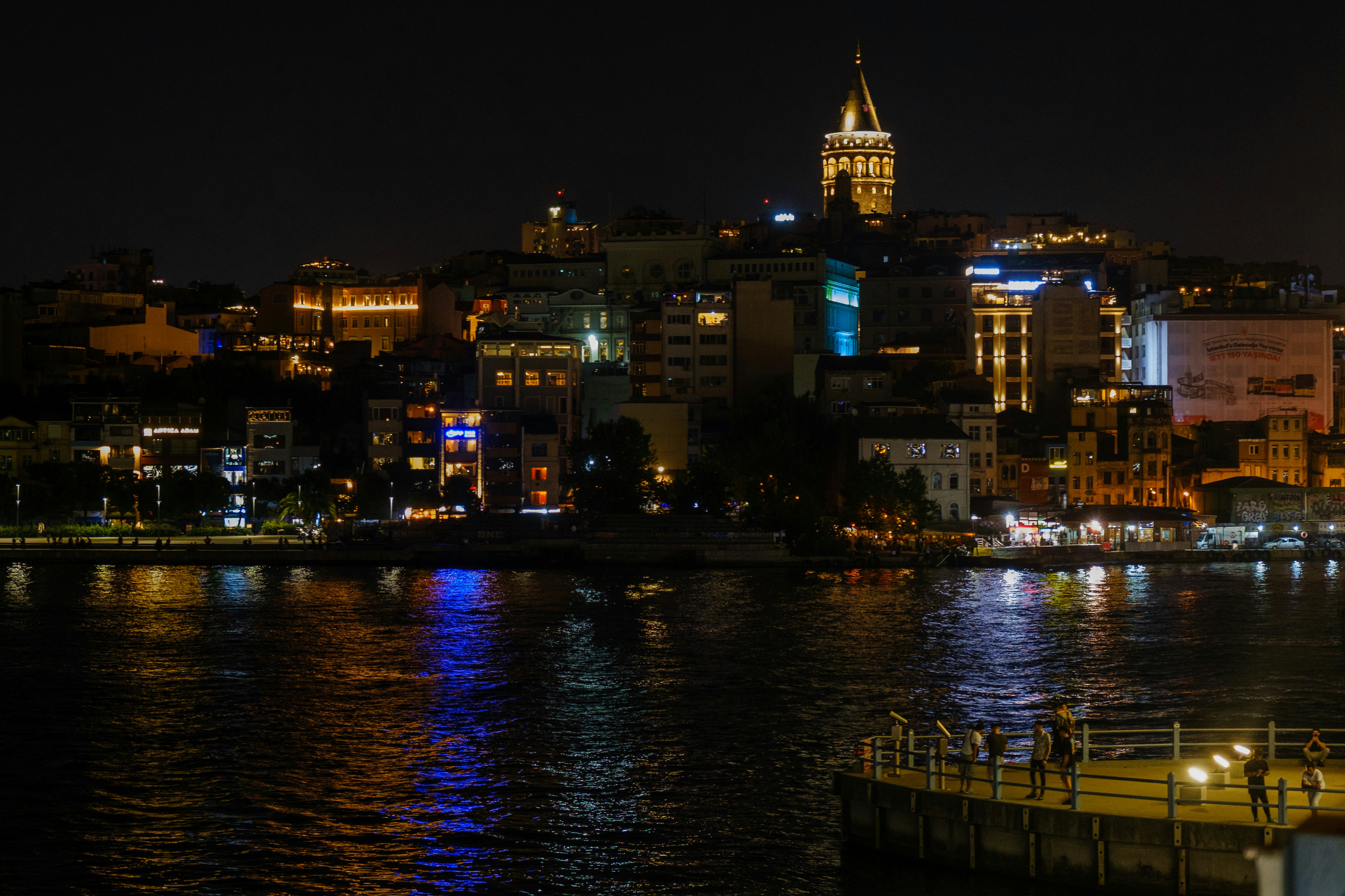 Night Skyline: Illuminated Waterfront and Clocktower Crown