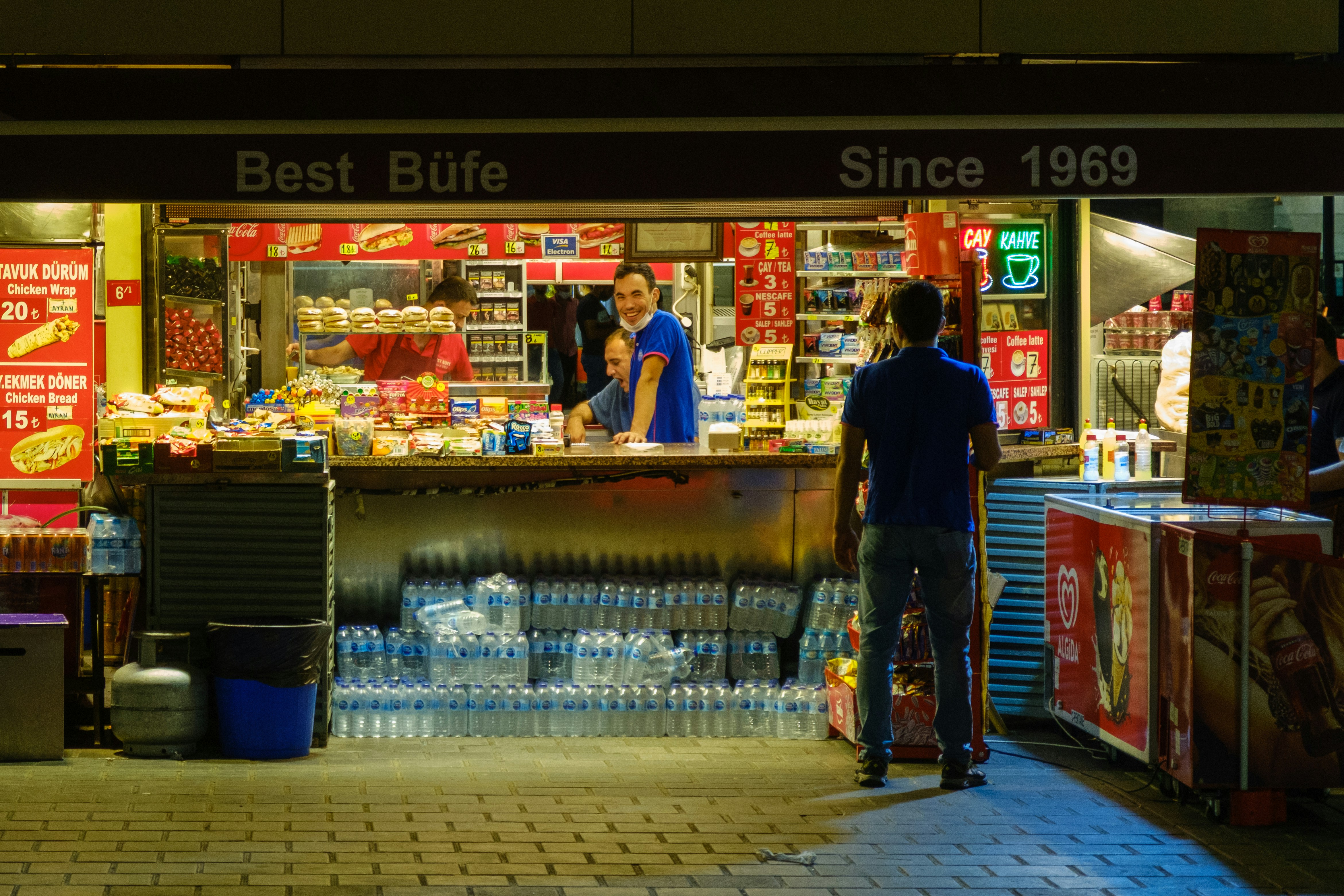 Night Food Stall: Friendly Exchange at a City Corner Shop