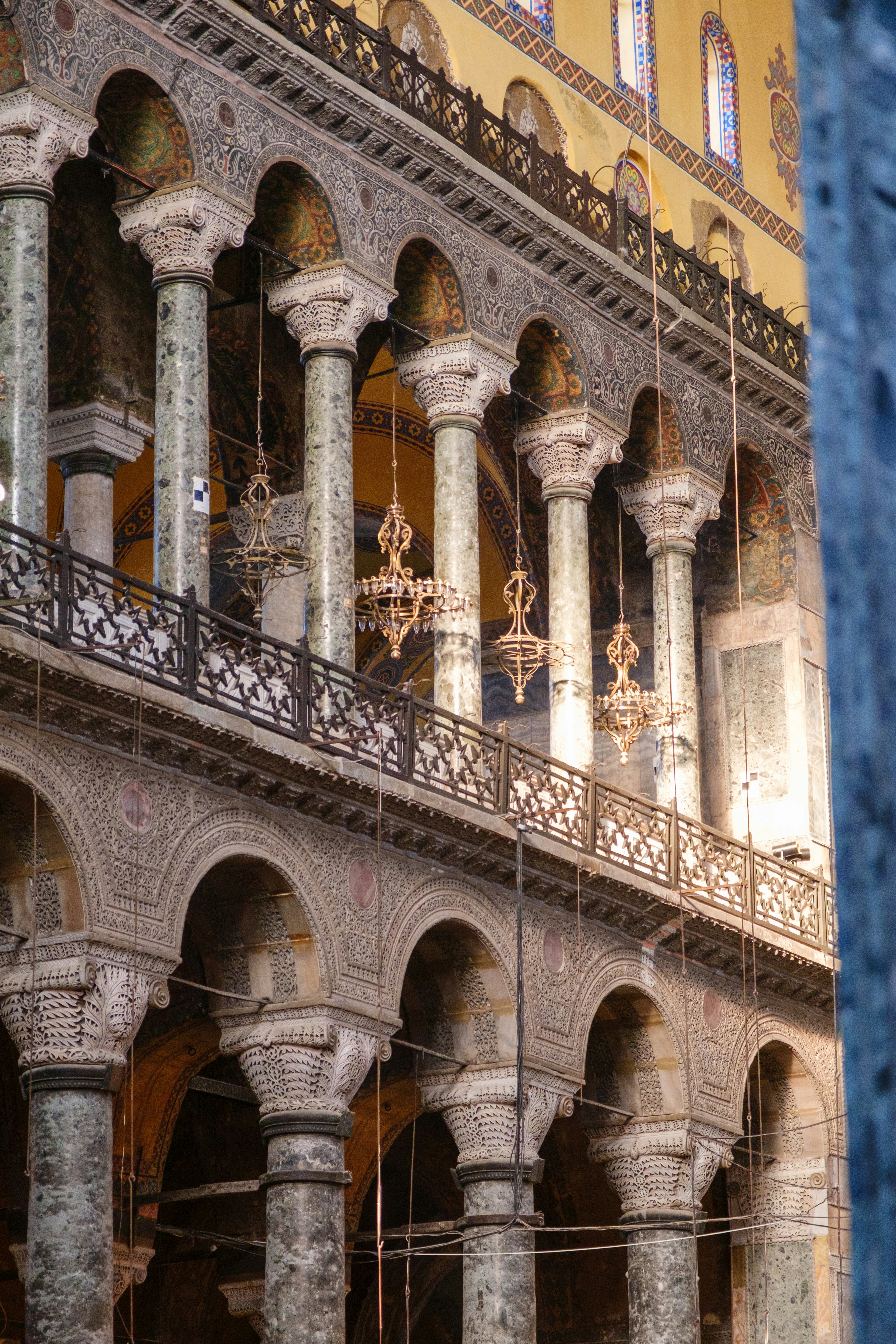 Granite arches and hanging lanterns: a courtyard of carved columns