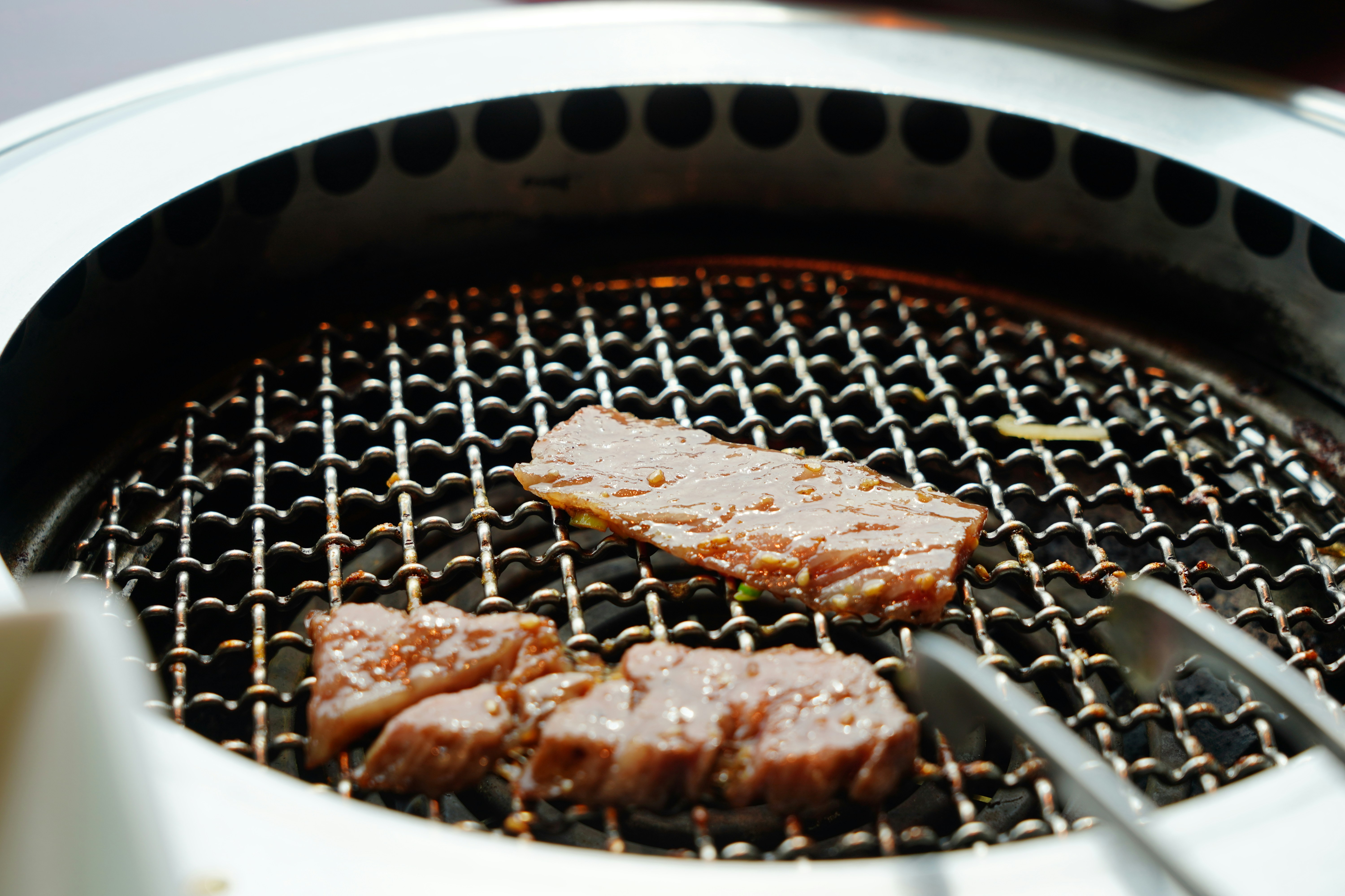 Sizzling Grill in Close-Up: Juicy Strips on a Hot Mesh