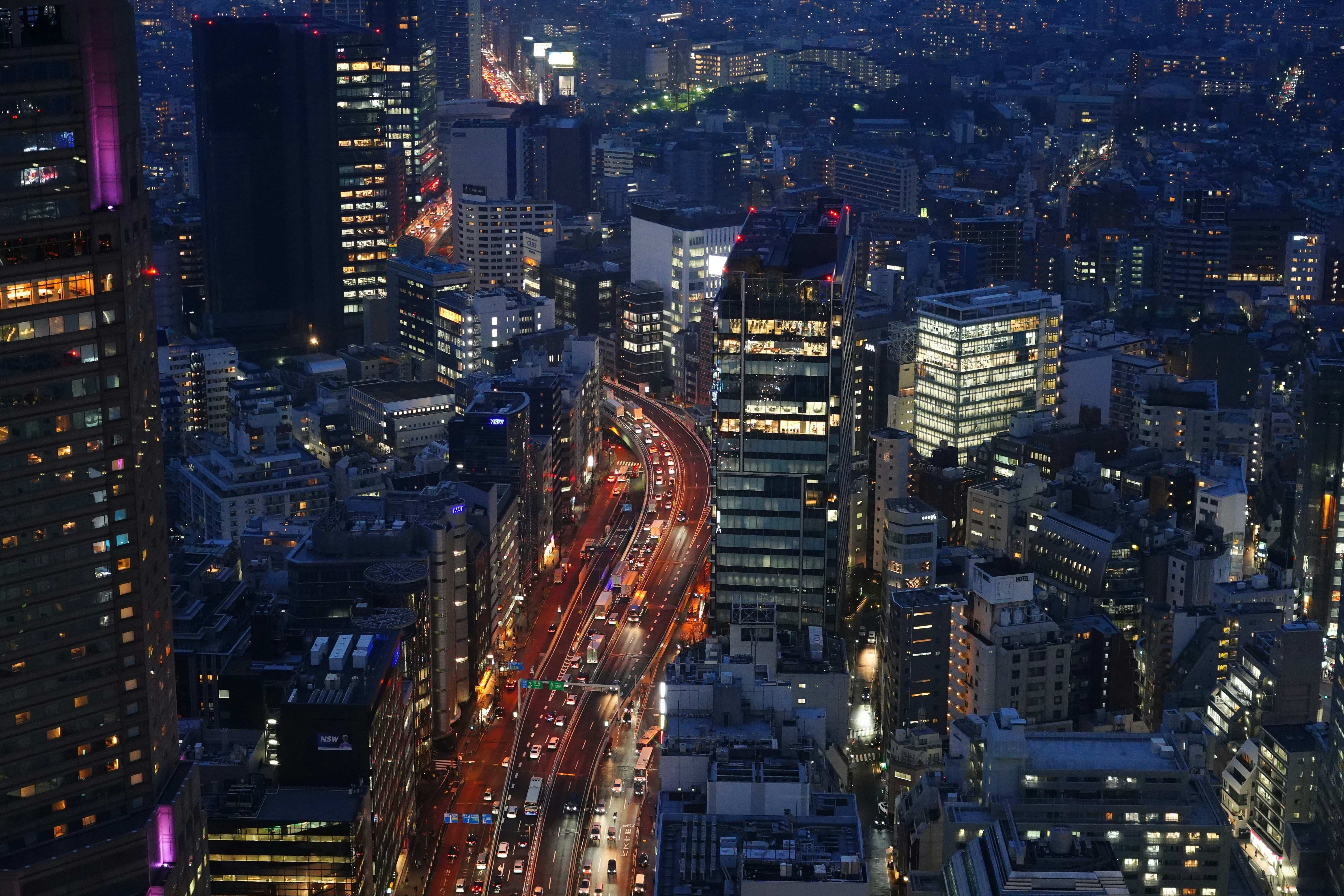 Neon Arteries: A Night Flight Above the City