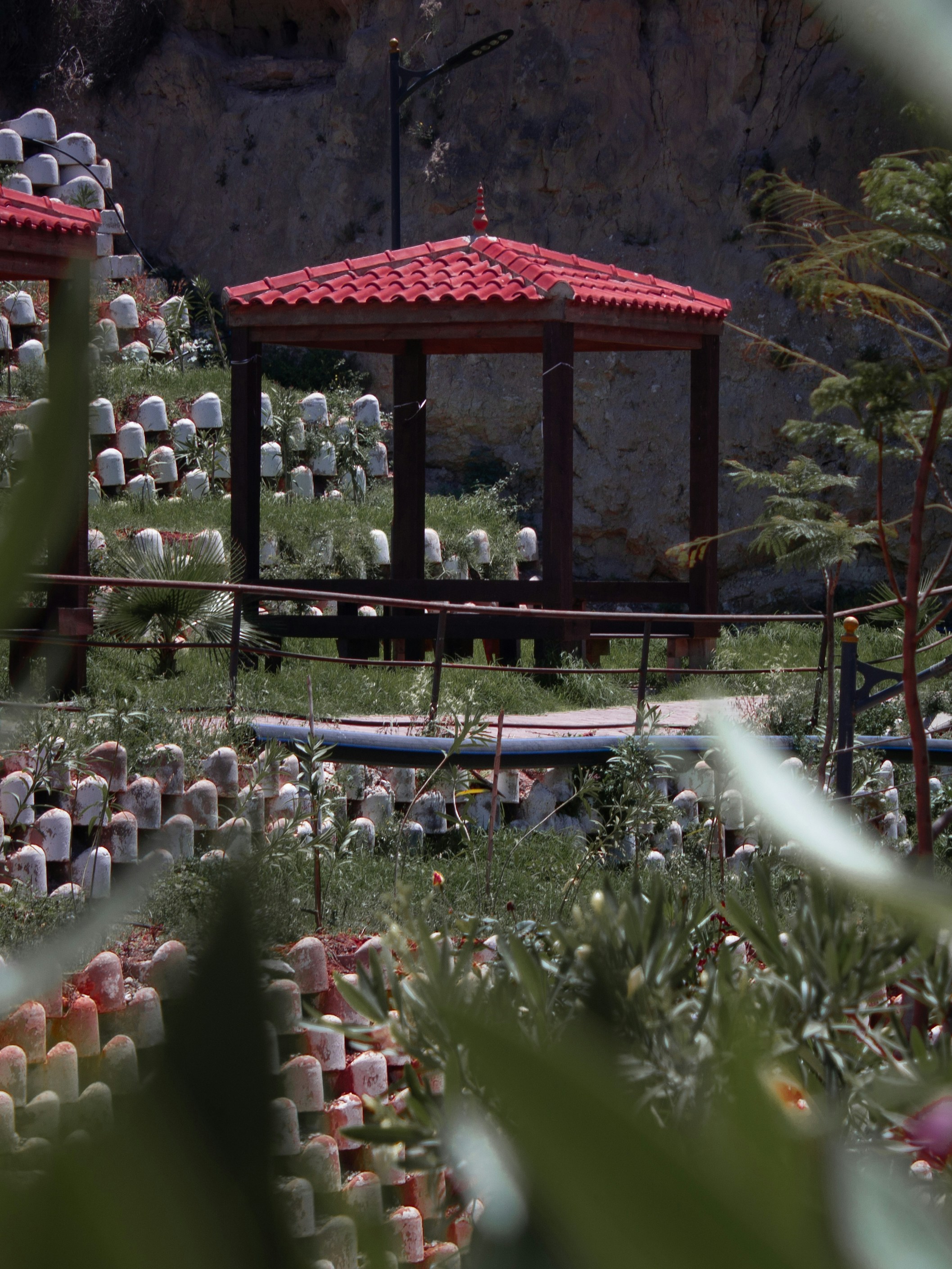 Red-topped Gazebo amid a sea of tombstones