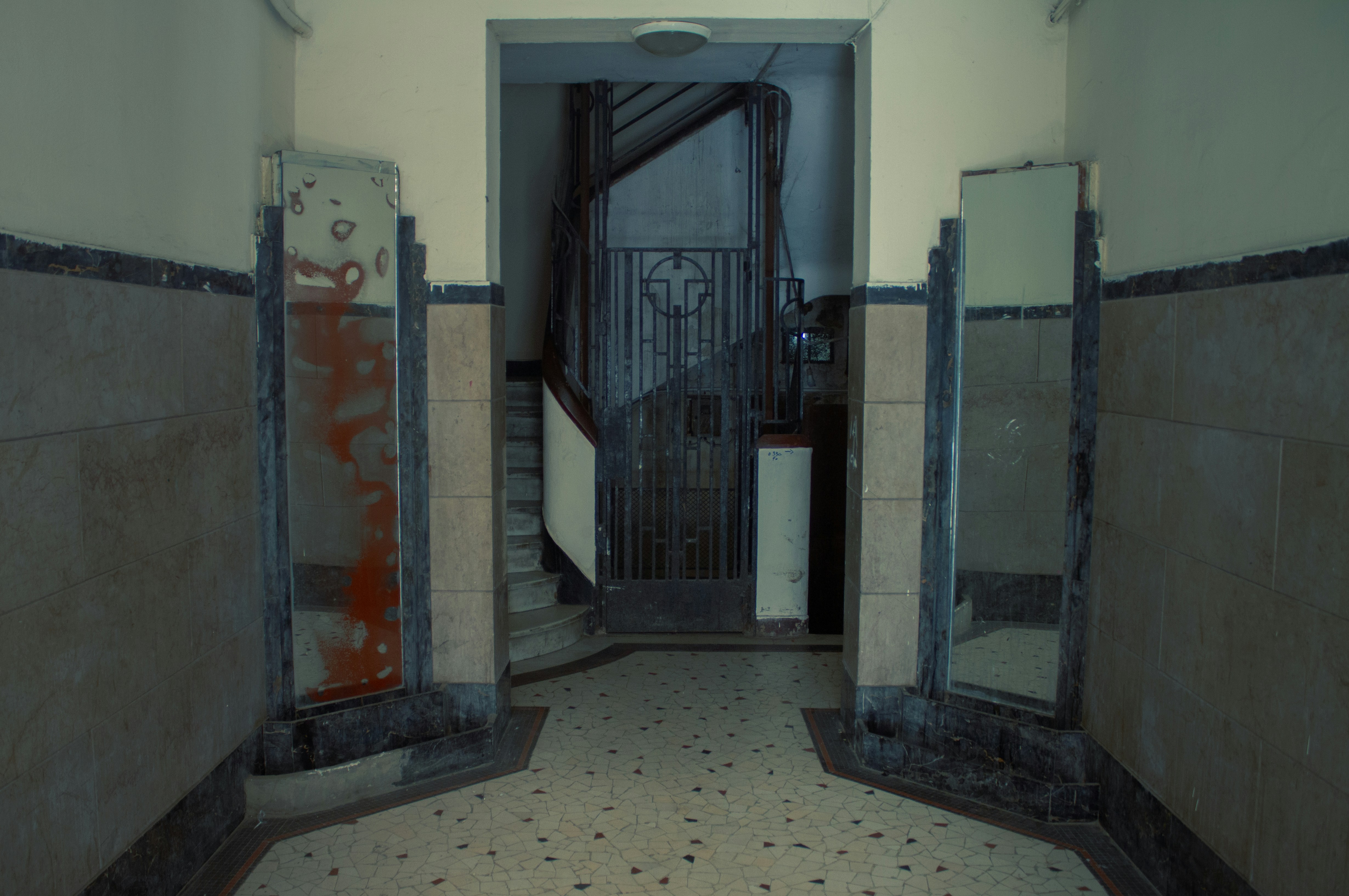 Echoes of an Abandoned Hallway: Mirrors Framing a Staircase