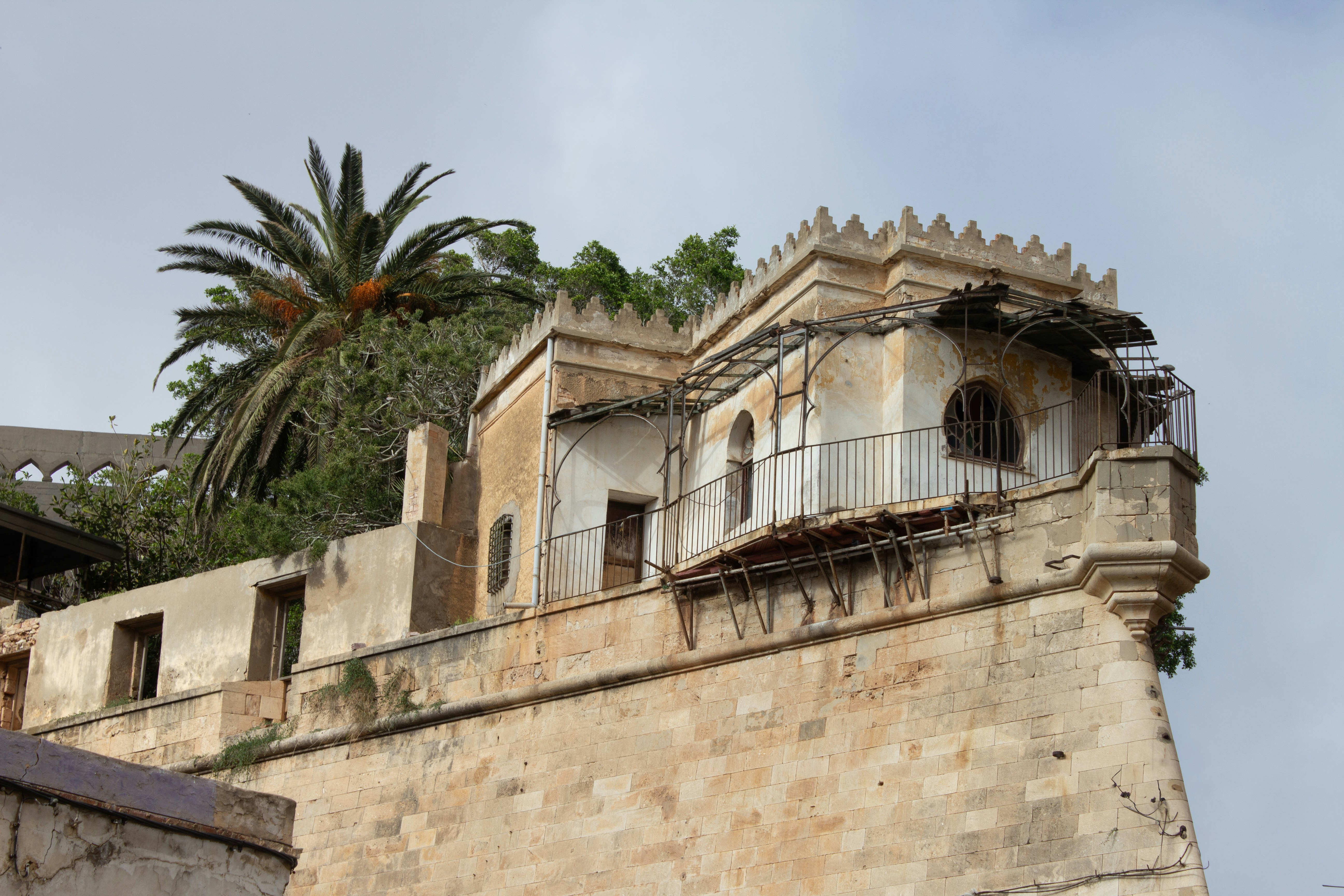 Rusted Balcony Overlook on a Sunlit Heritage Terrace