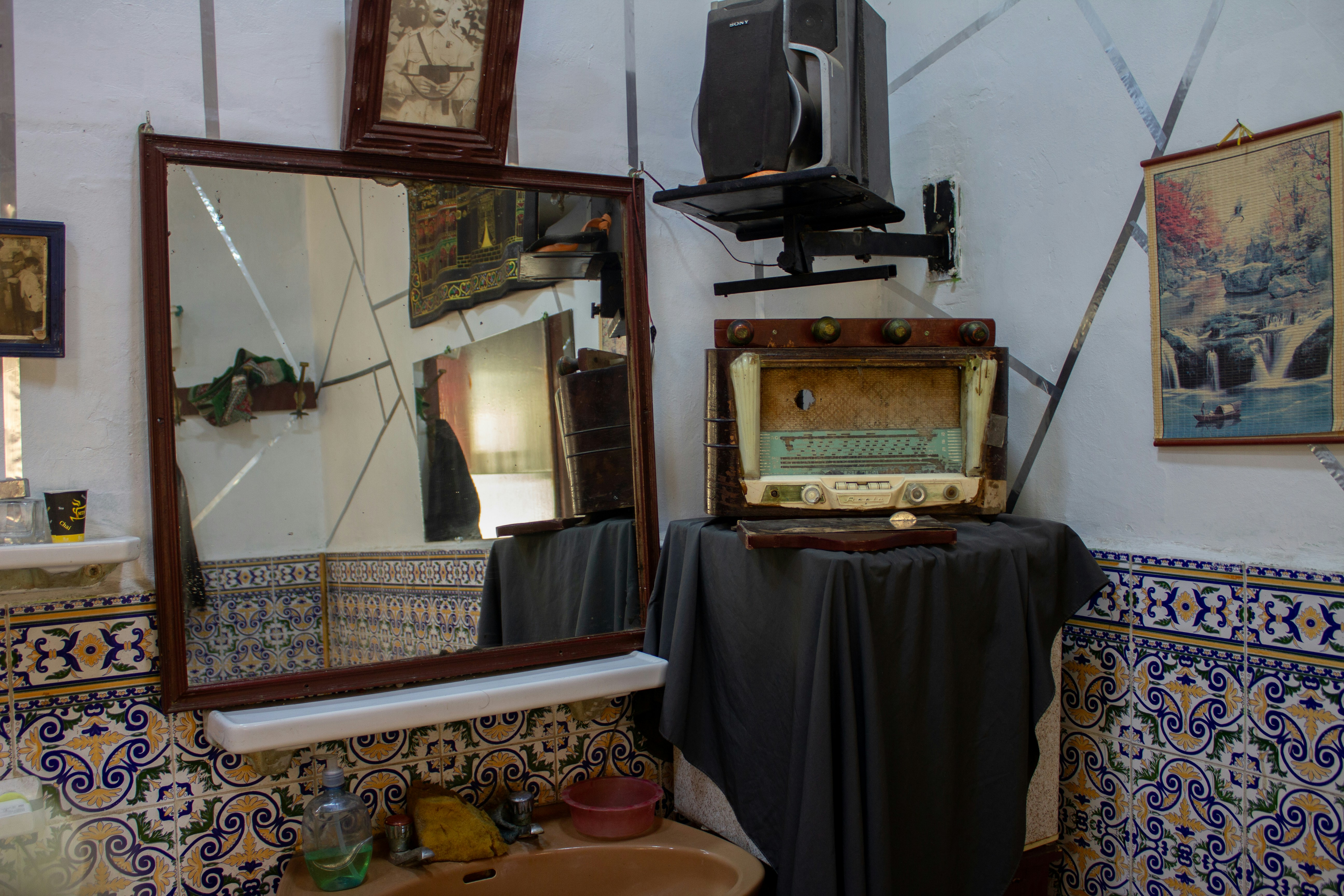 Mirror, radio, and tiles: a retro dressing room still life