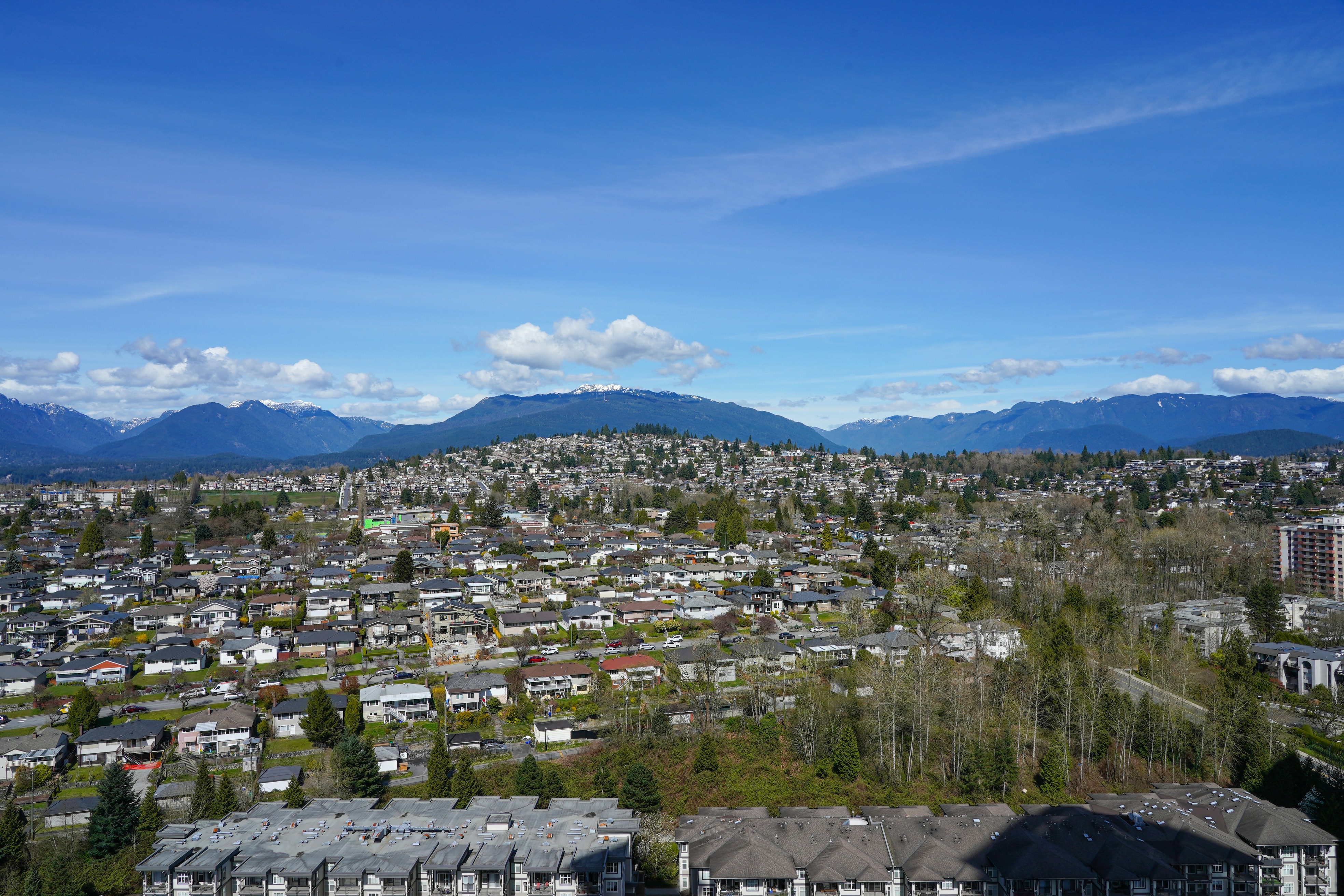 Panoramic Valley Village under a Clear Mountain Sky