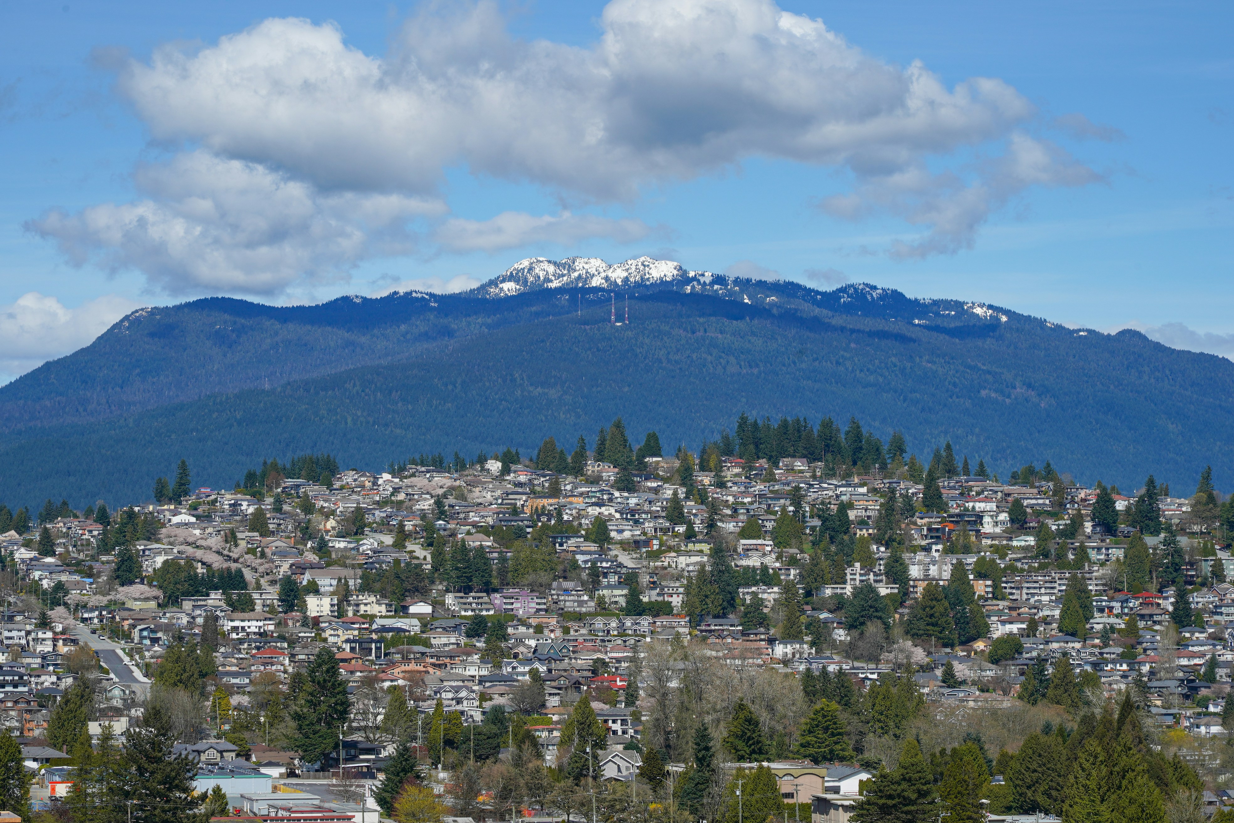 Snow-dusted ridge above a suburban valley