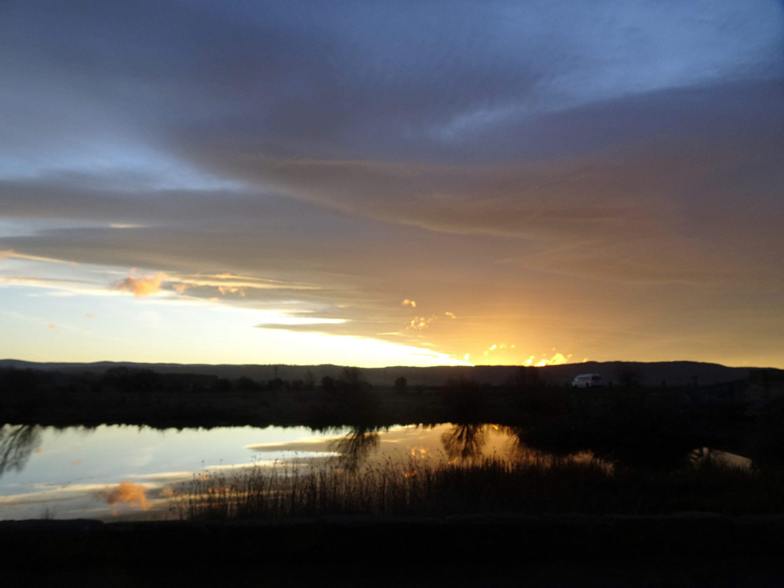 Sunset Mirror: Quiet Wetland Reflects a Golden Sky