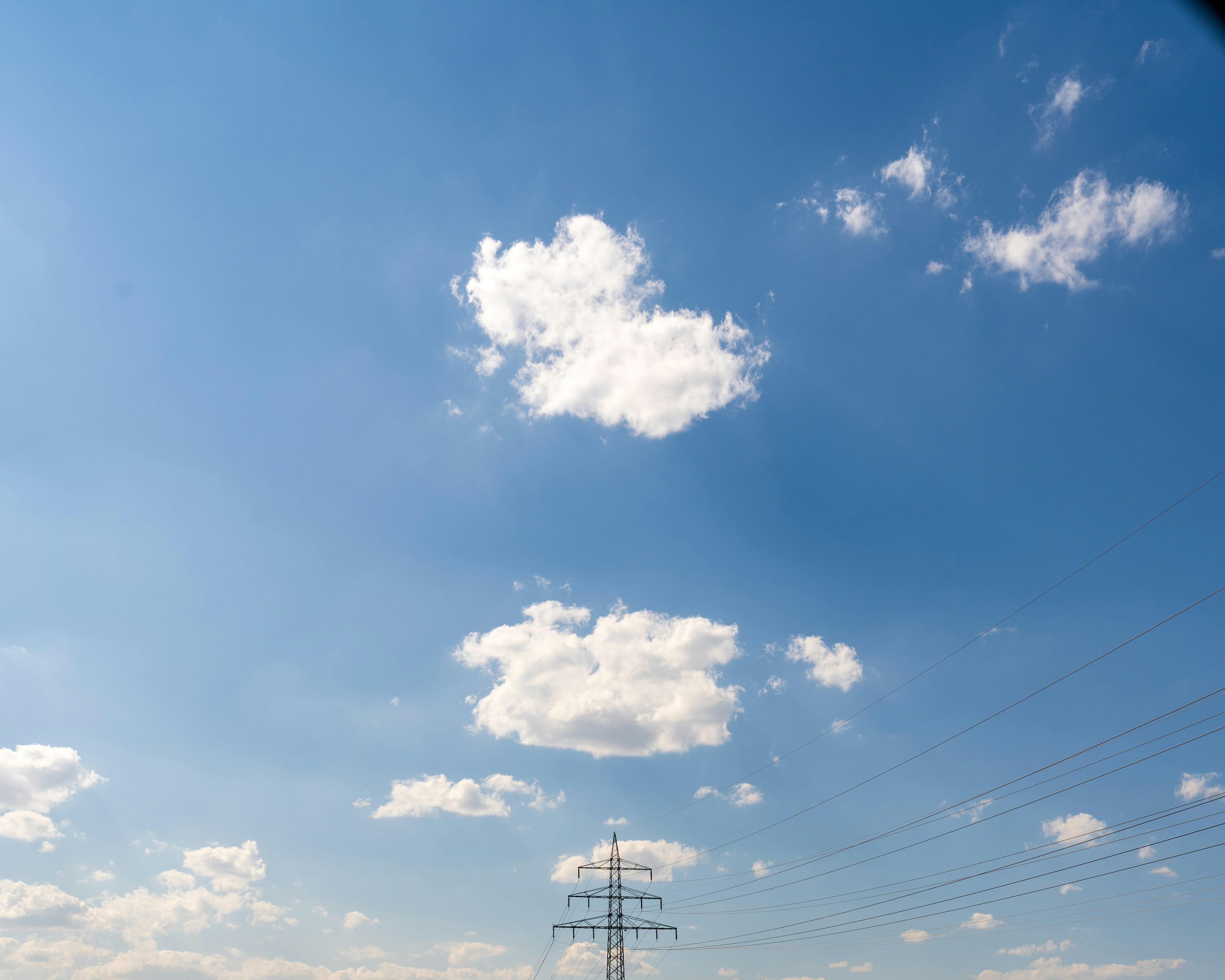 Cumulus Cascade Under a Clear Blue Vault