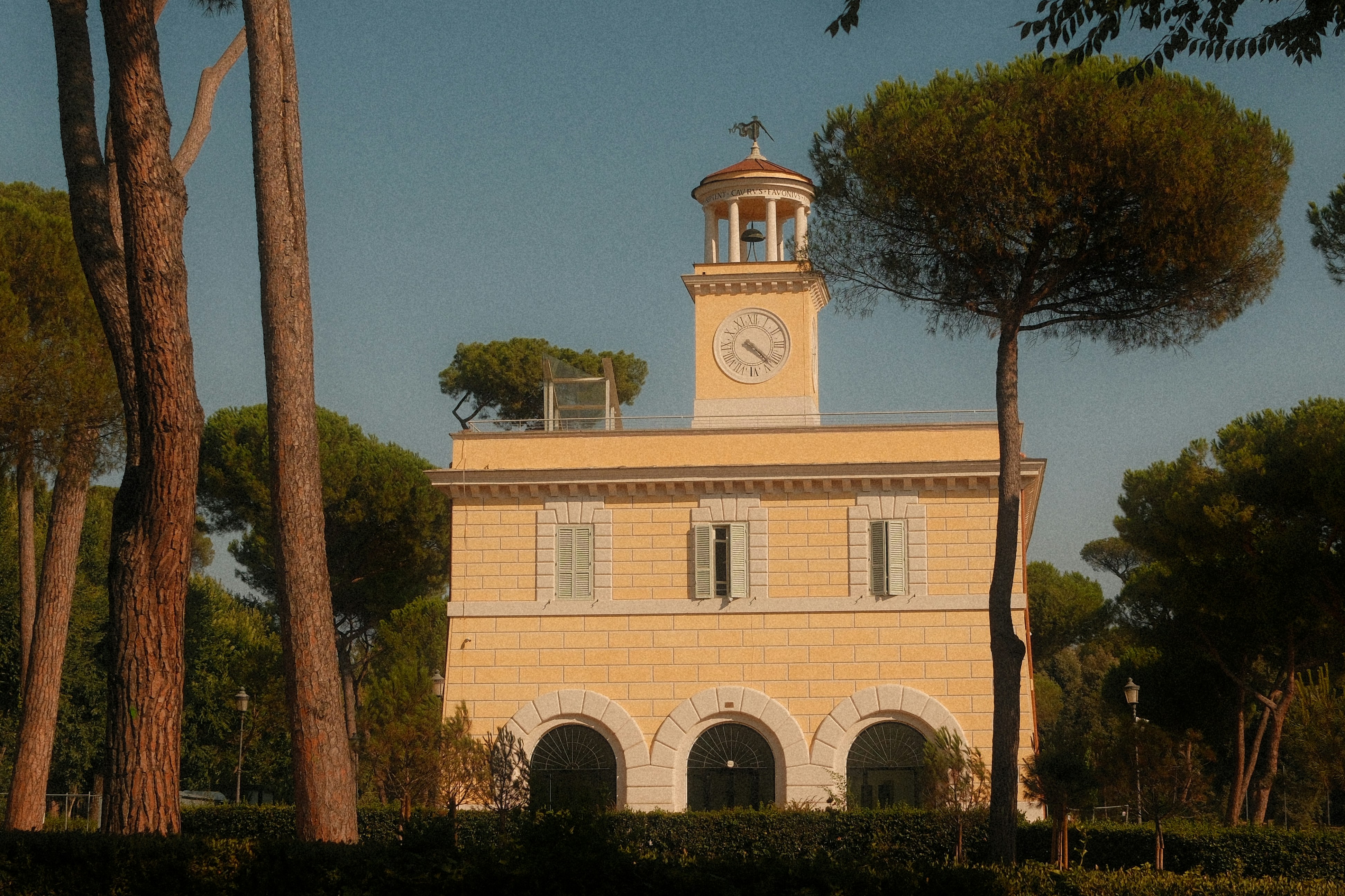 Clocktower Facade Under a Mediterranean Canopy