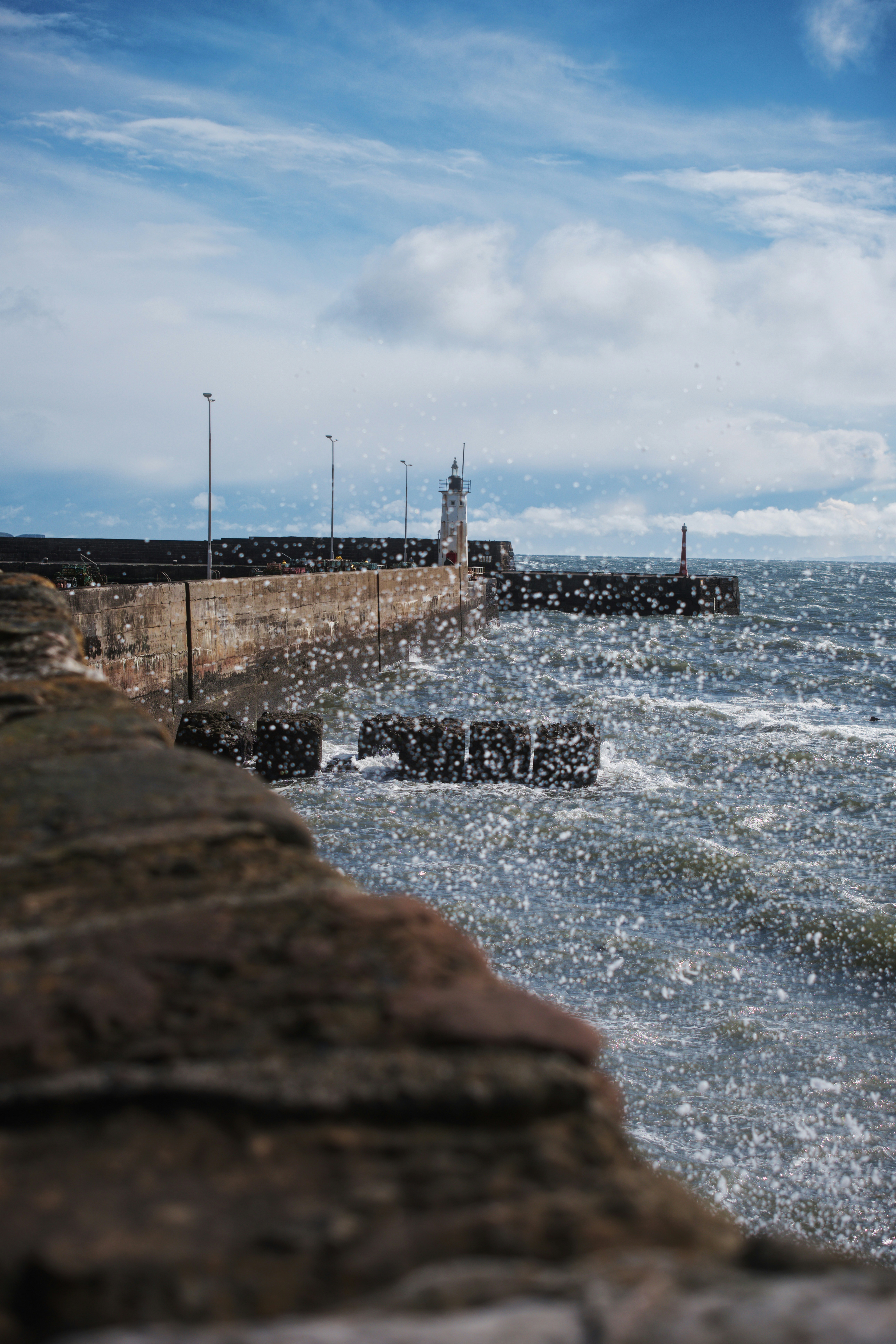 Harbor Lights at Sea Wall: Spray in Focus