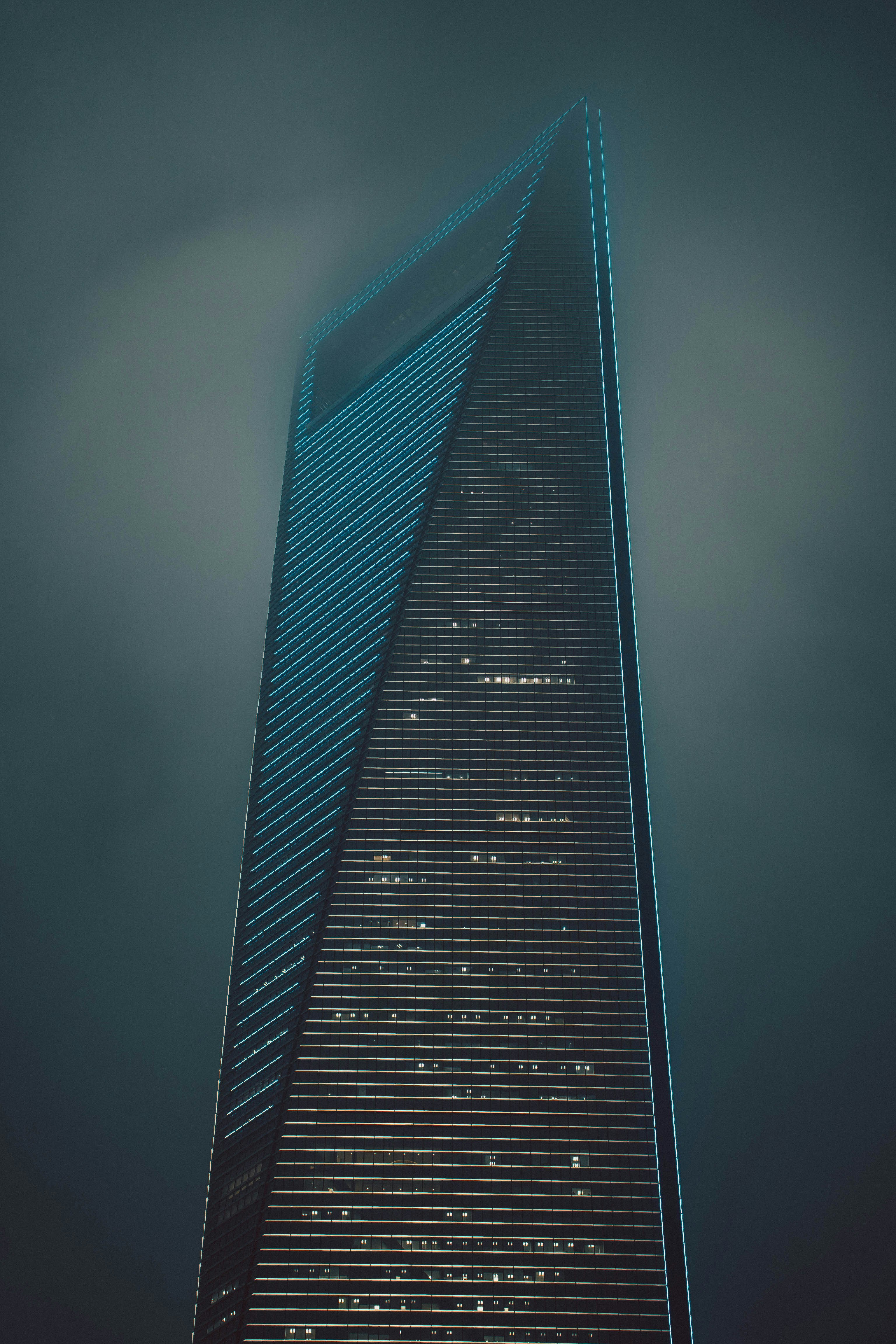 Midnight Needle: A Skyscraper Piercing a Cloudy Atlantic Blue
