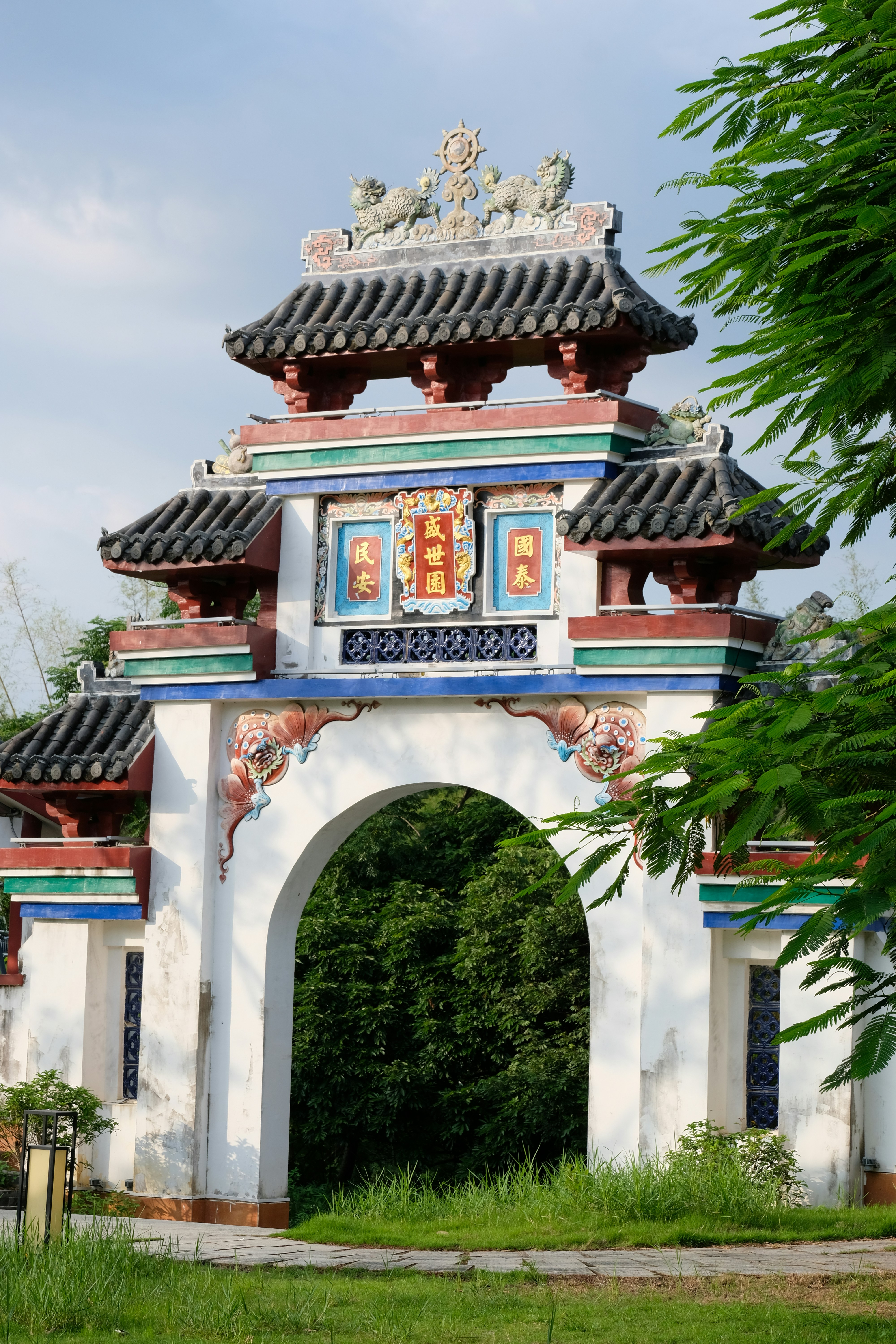 Temple Archway in Blooming Green Courtyard