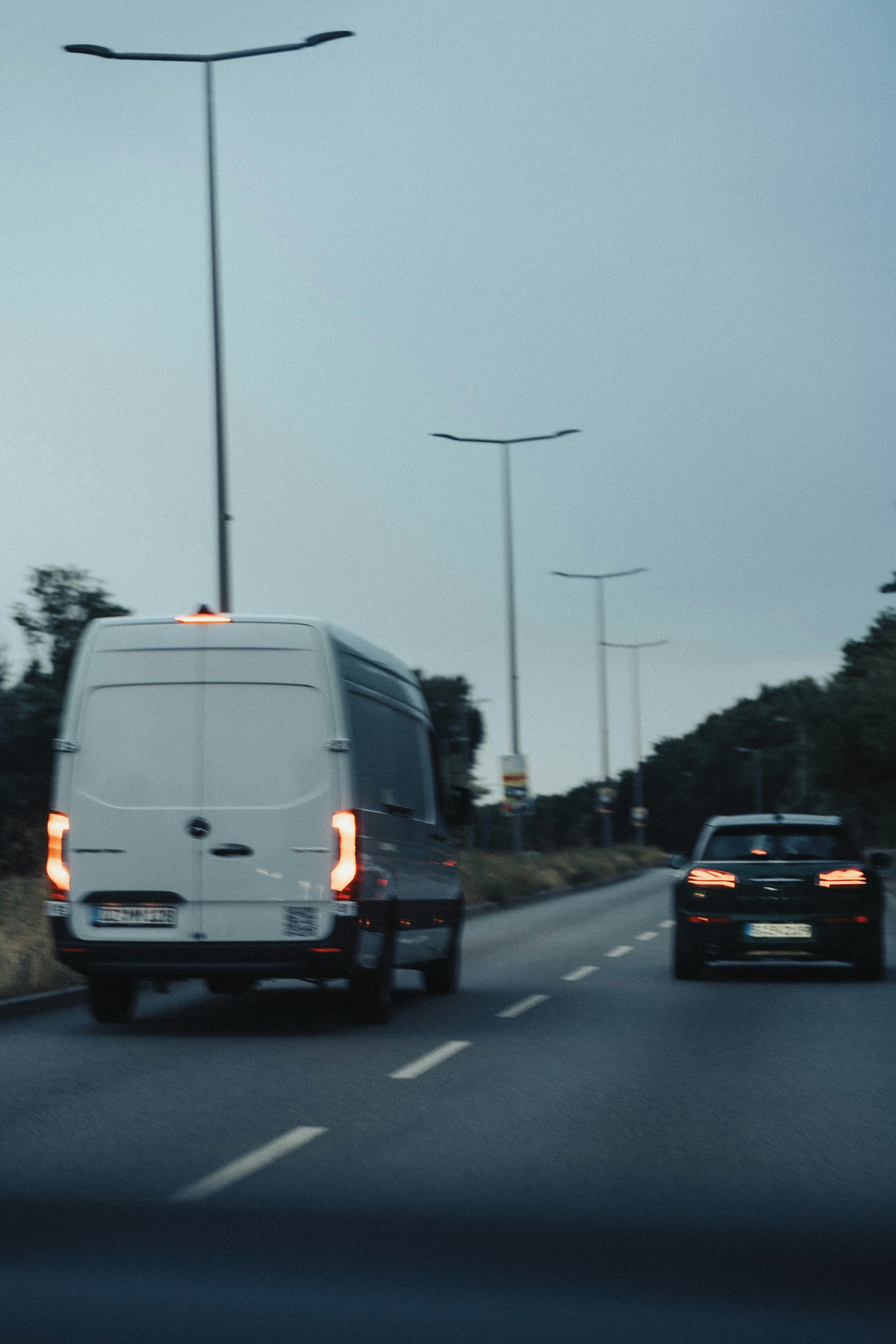 Rear-Track Focus: A Vanishing Road in Evening Light