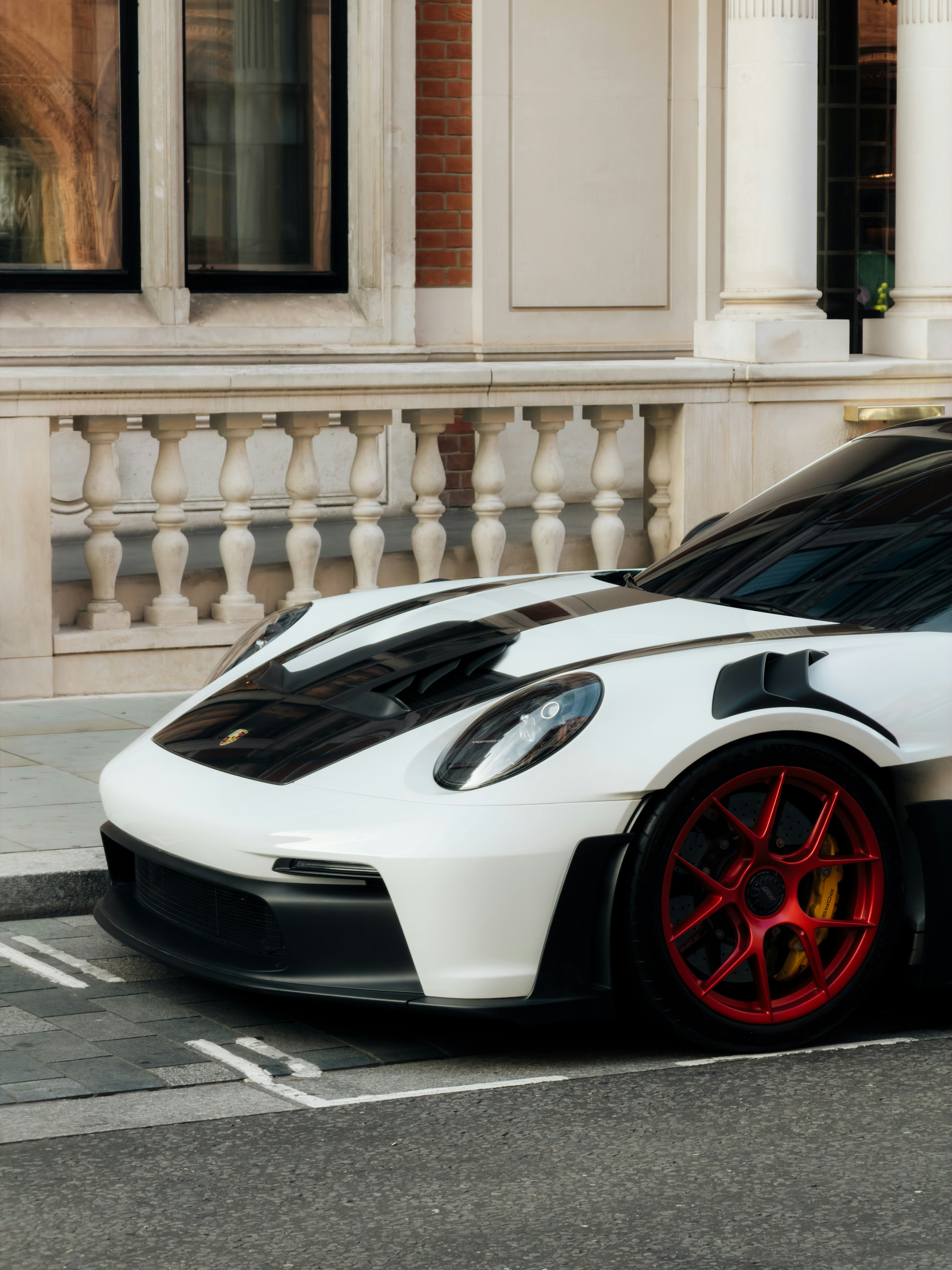 White Porsche at the Edge of an Elegant Facade