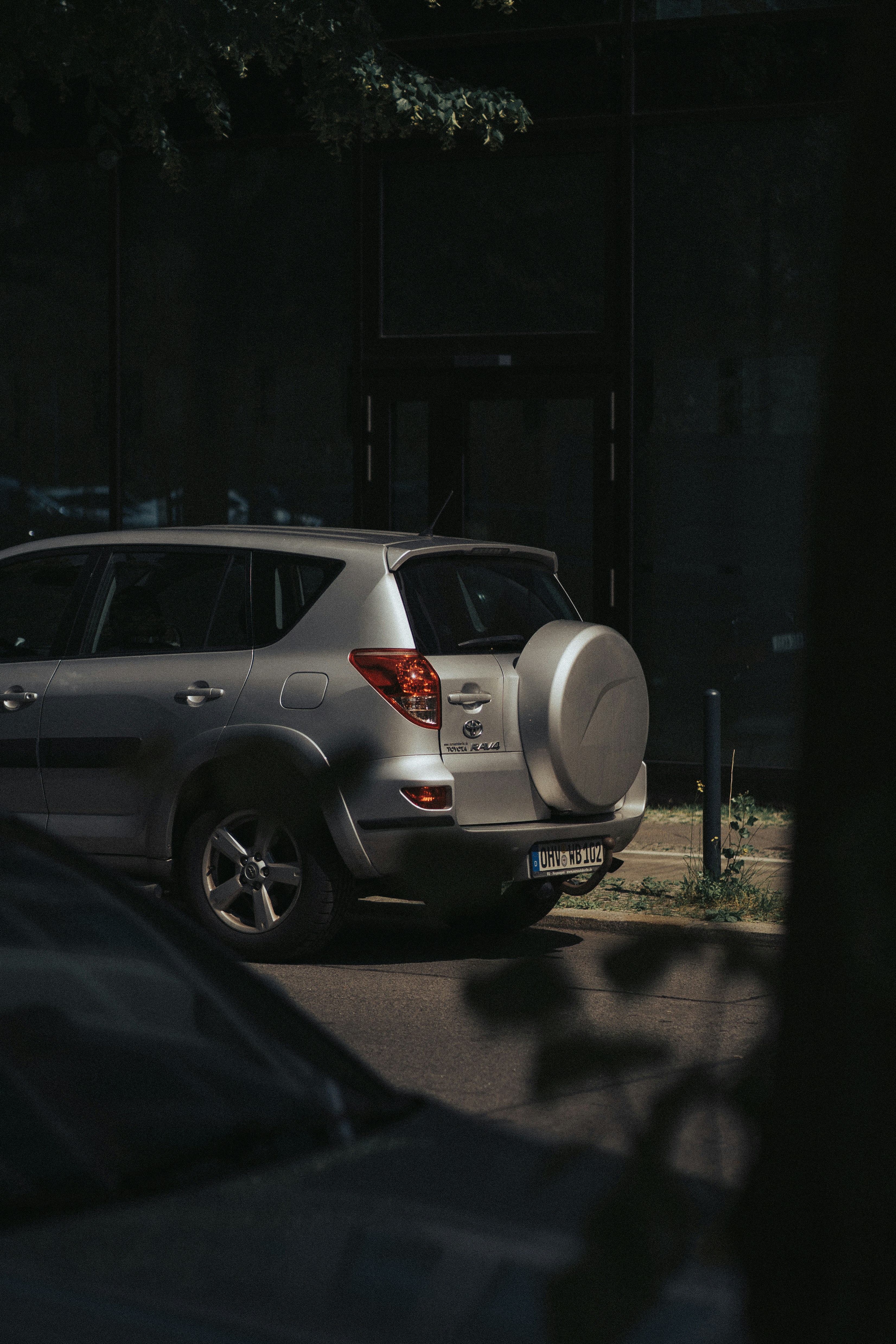 Silver SUV in a Shadowed Street Frame