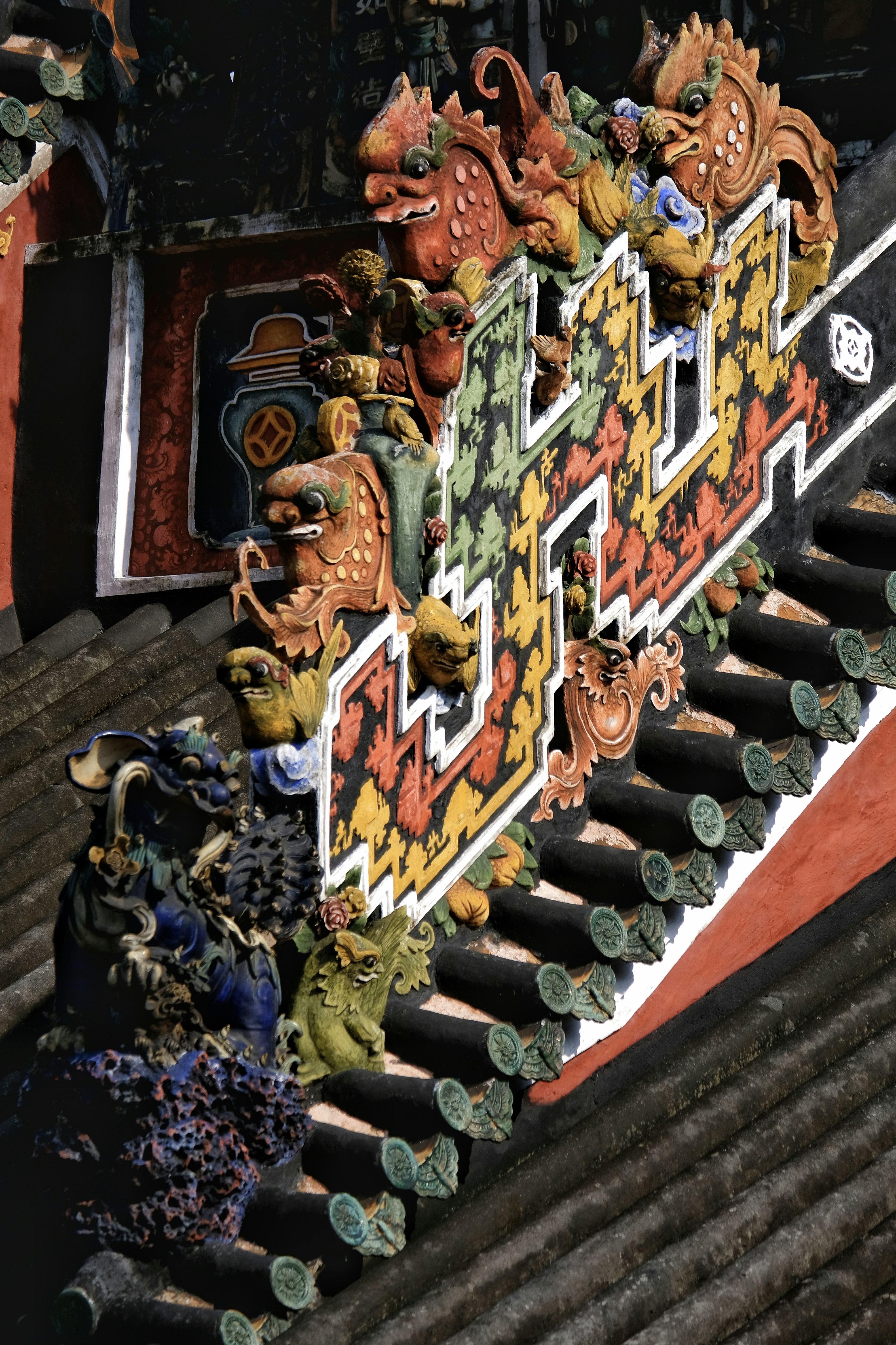 Dragon Frieze in Carved Eave: A Colorful Ridge of Mythic Figures