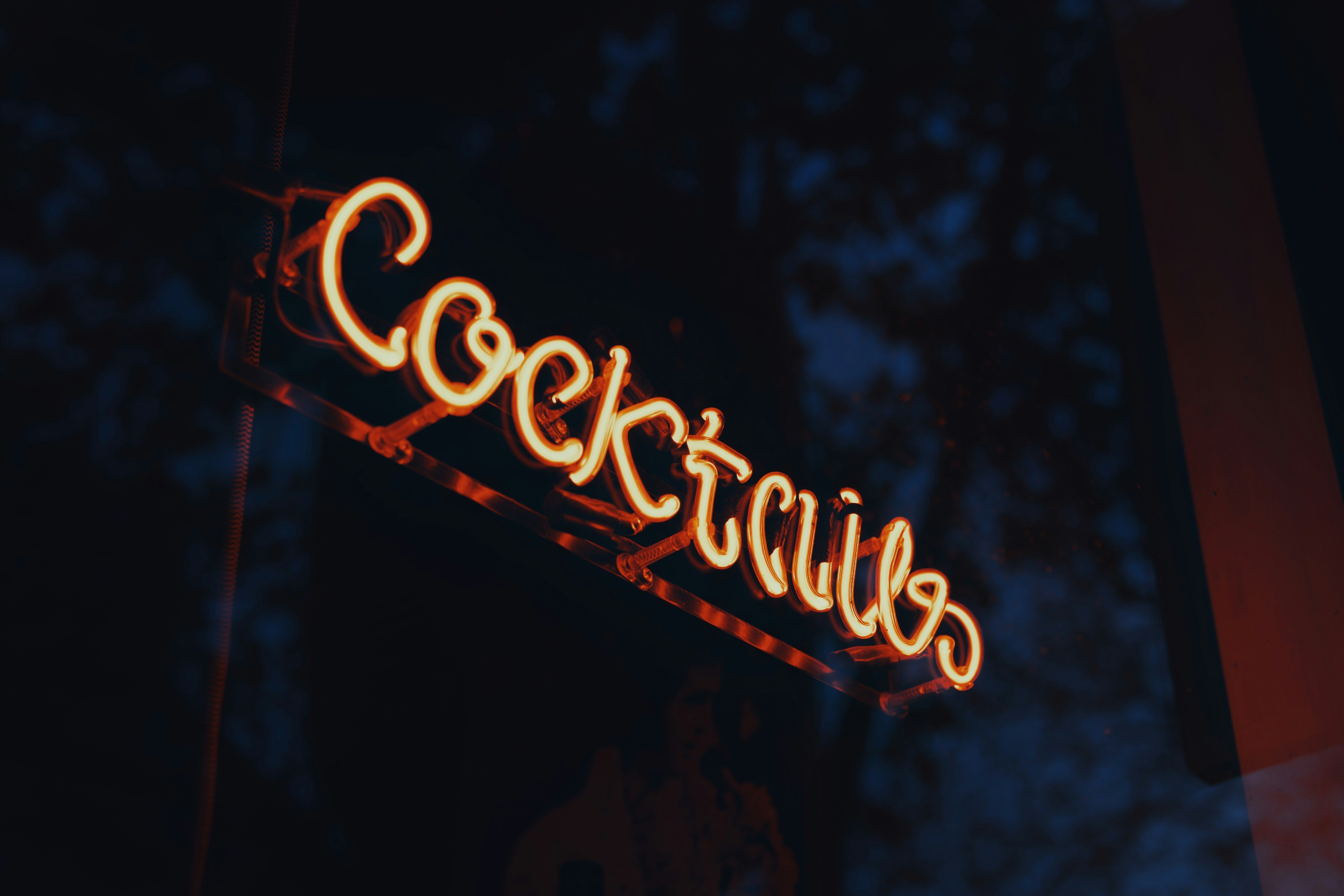 Neon Cocktail Sign in Night-Glow Window