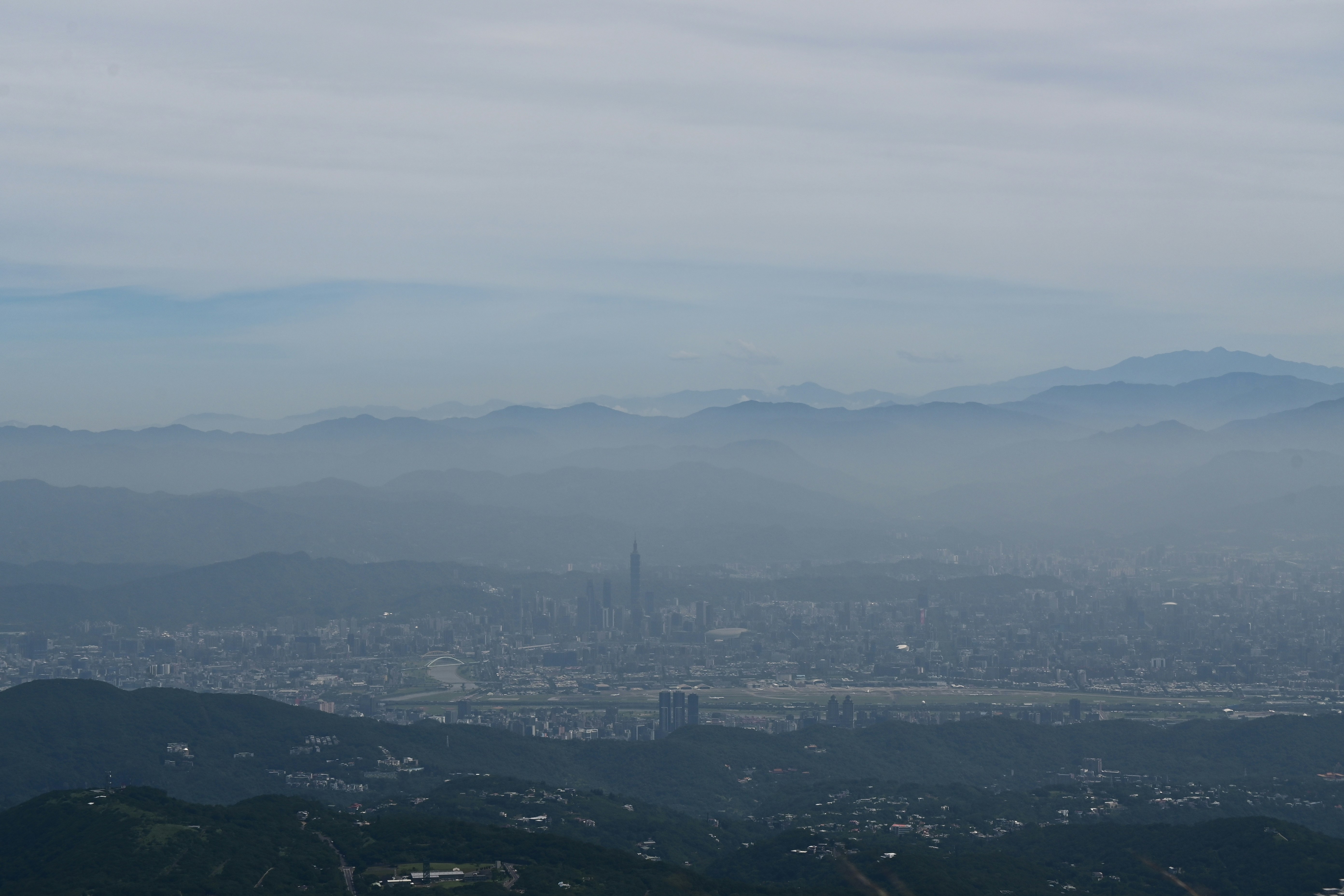 Horizon City: Layers of Distant Peaks Beyond a Quiet Valley