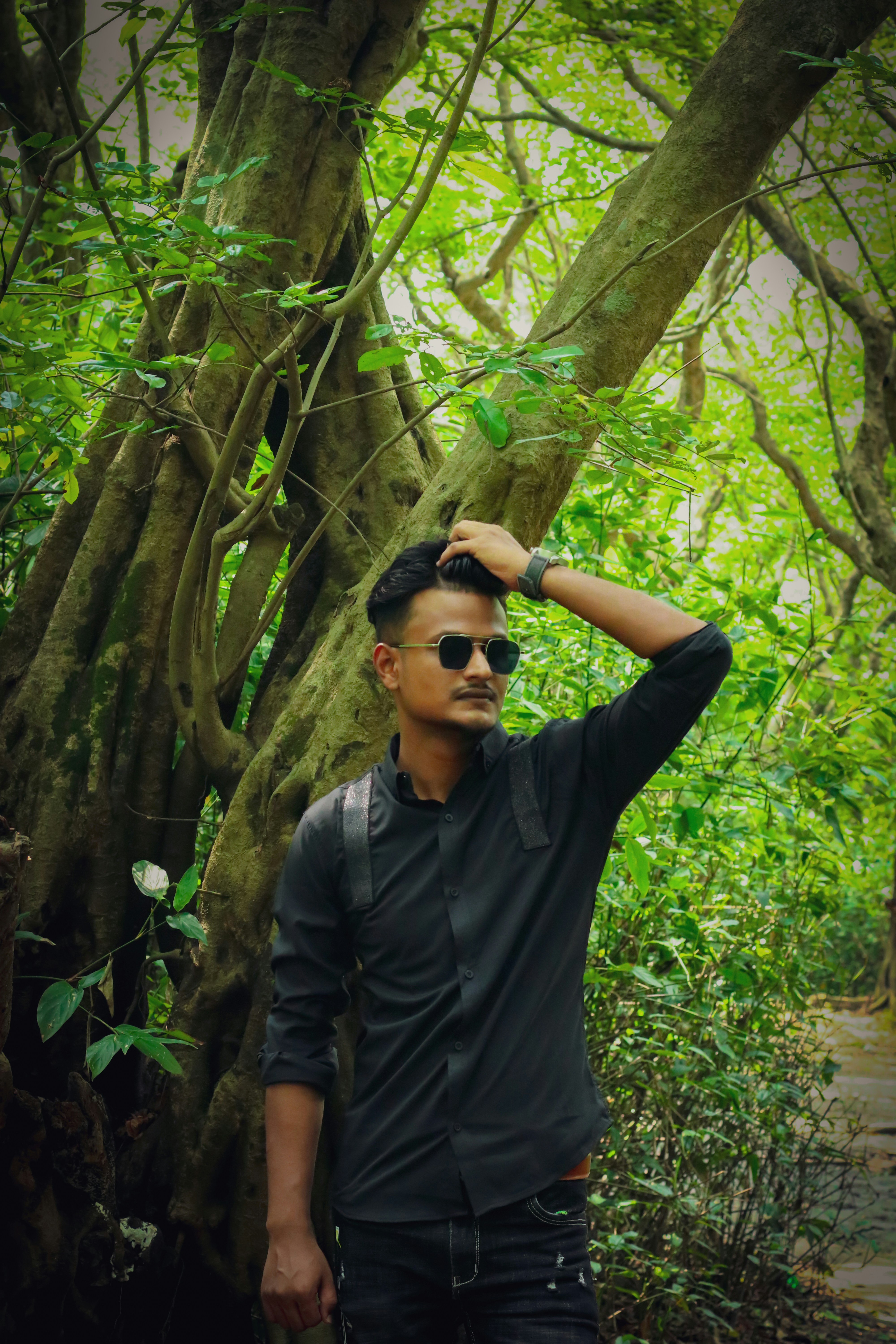 Shadowed in Green: A Cool Confident Portrait Beneath the Jungle Canopy