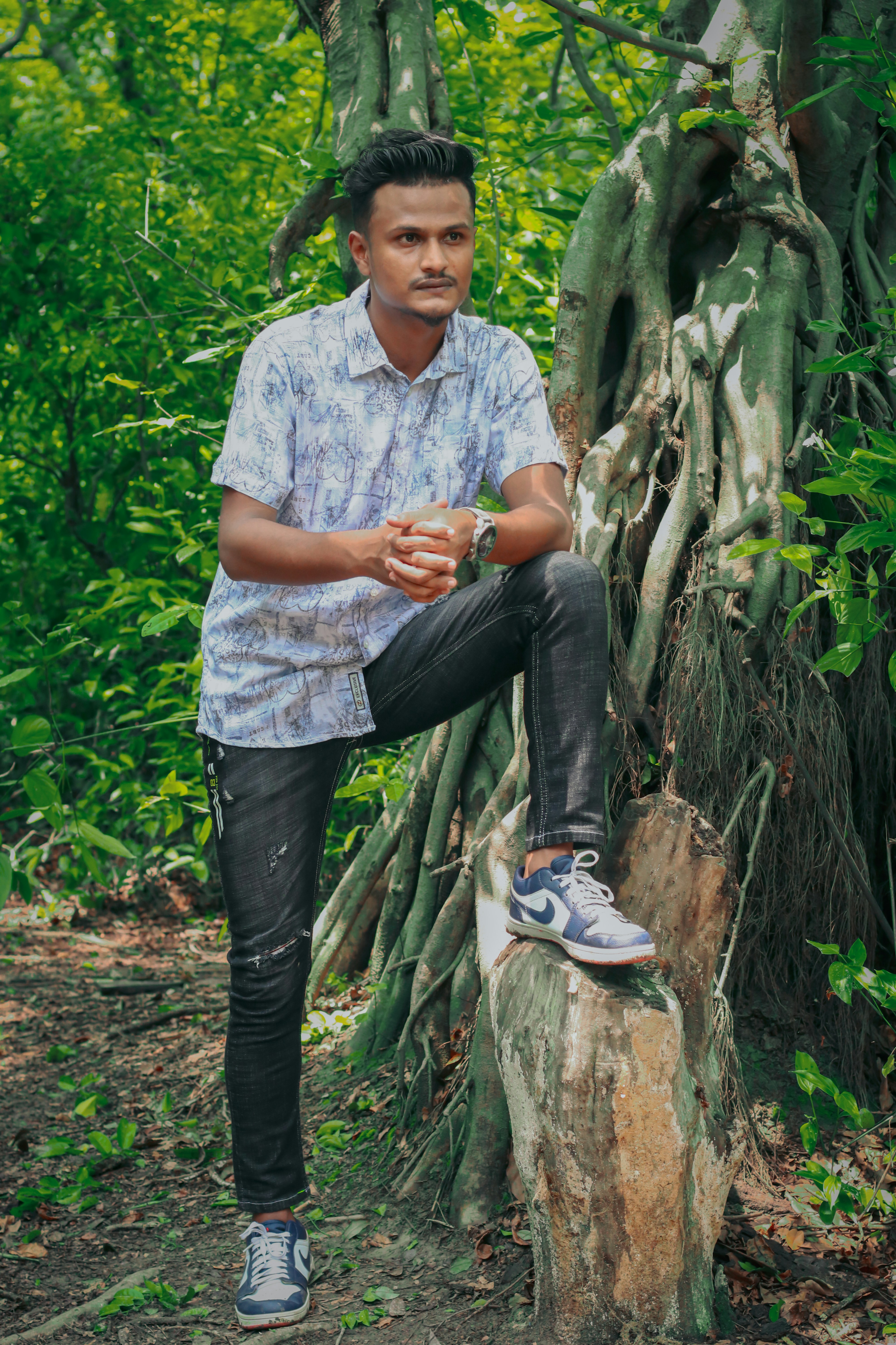 Rooted Confidence: A Quiet Pose Beneath Ancient Giants