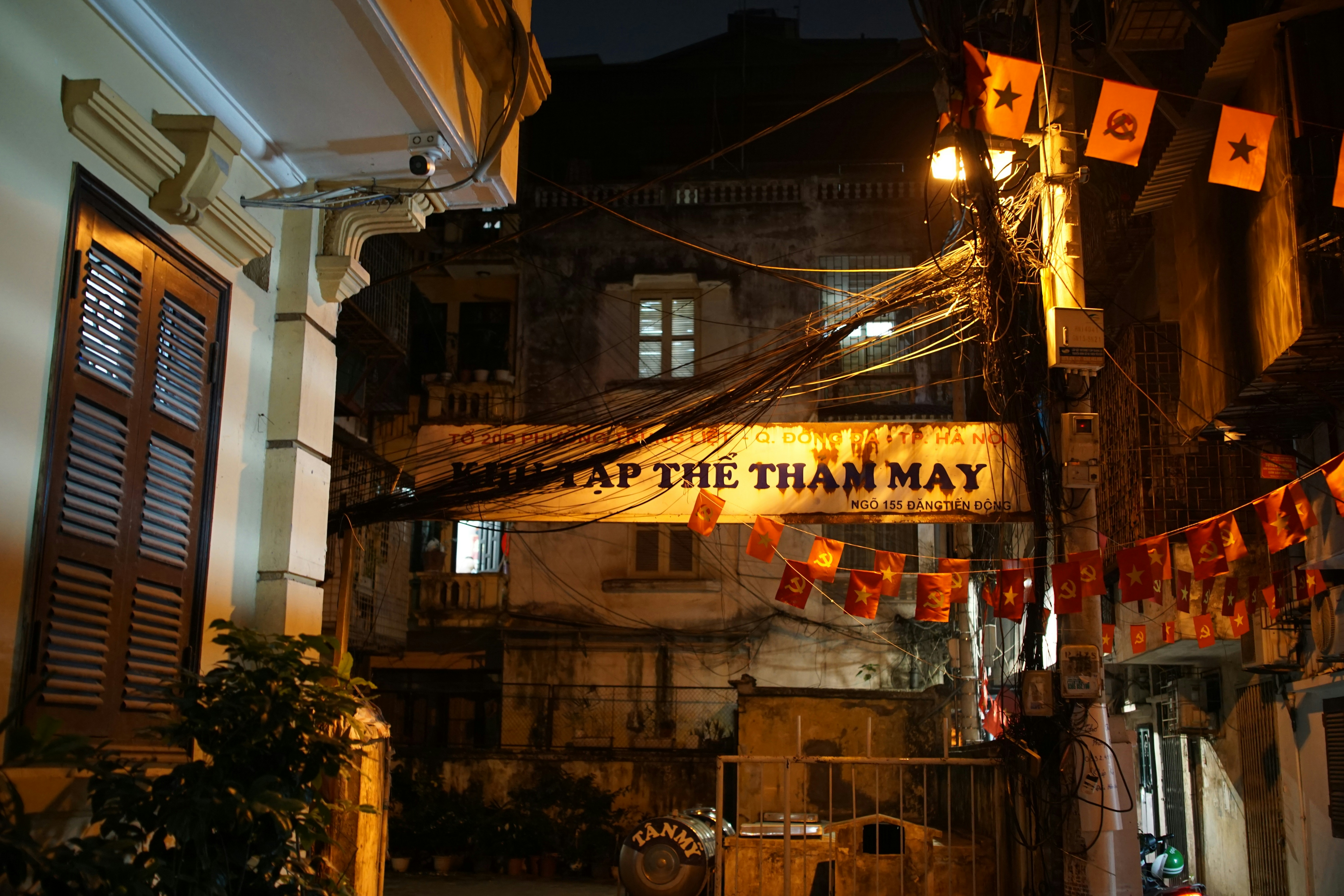 Lanterns and Banner: Night Market Alley of Tham May