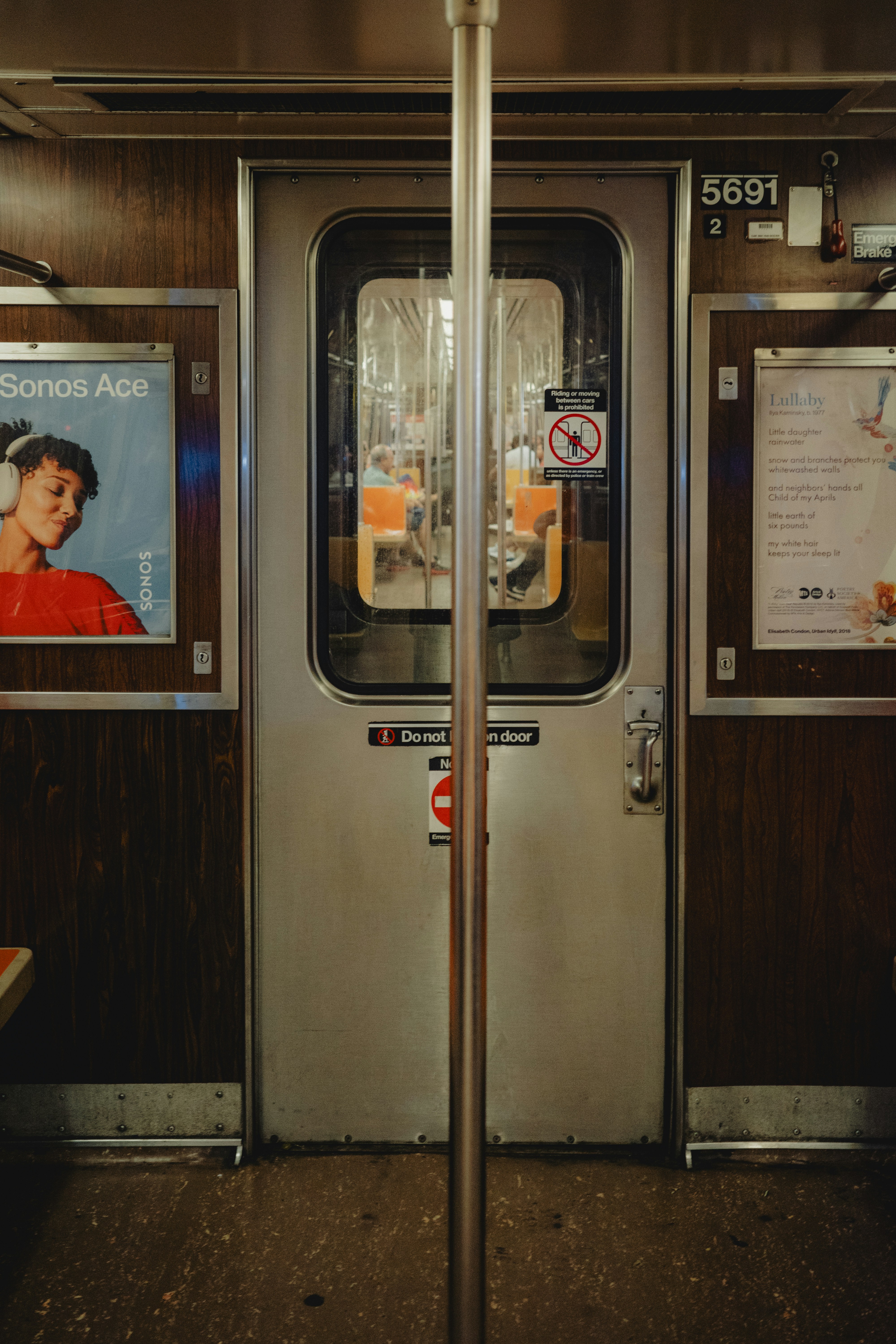 Midway Threshold: A Subway Door Framed by Ambient Light and Silence