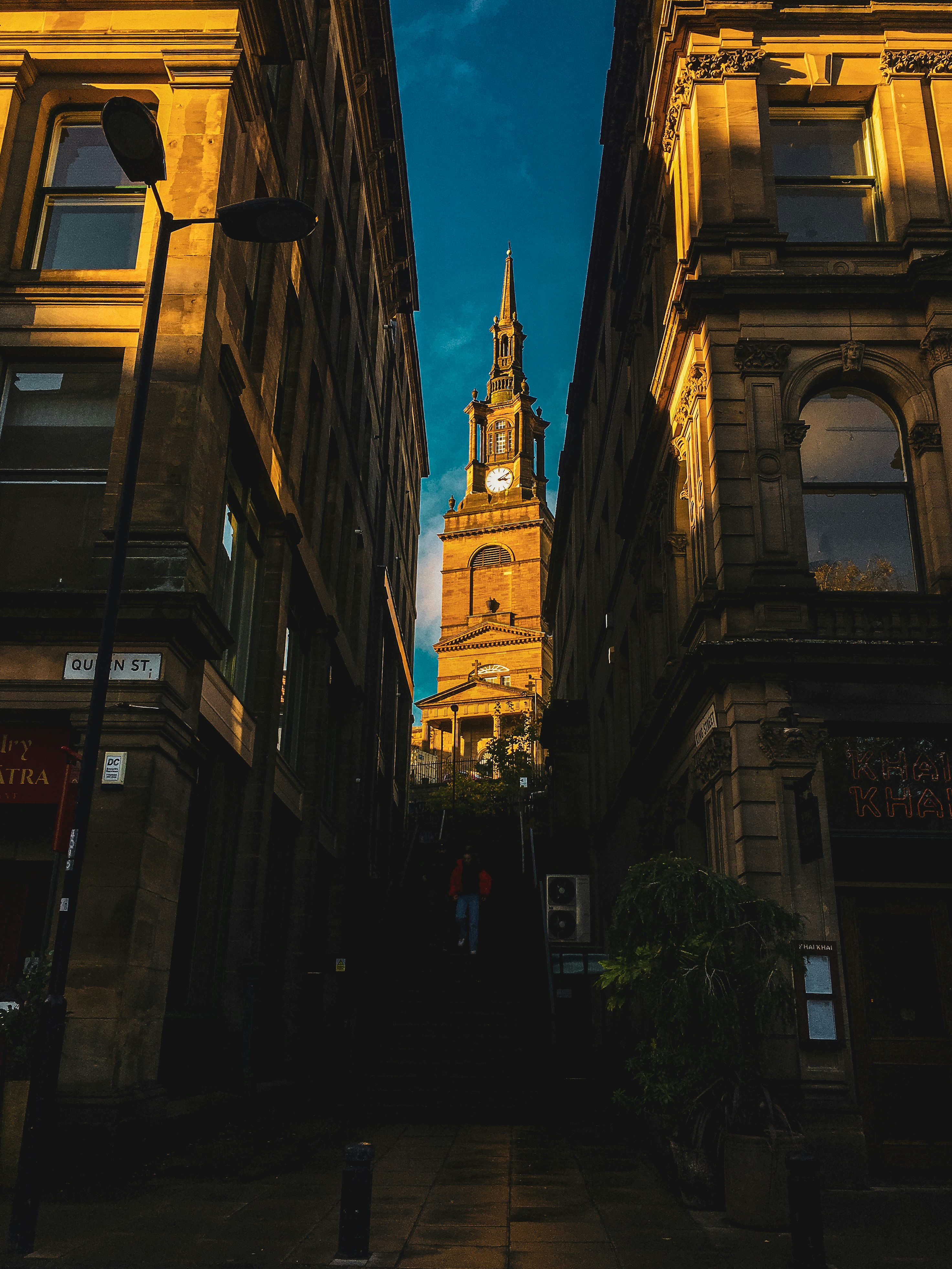 Clocktower Between the Stones: A City Dawn Between Narrow Alleys