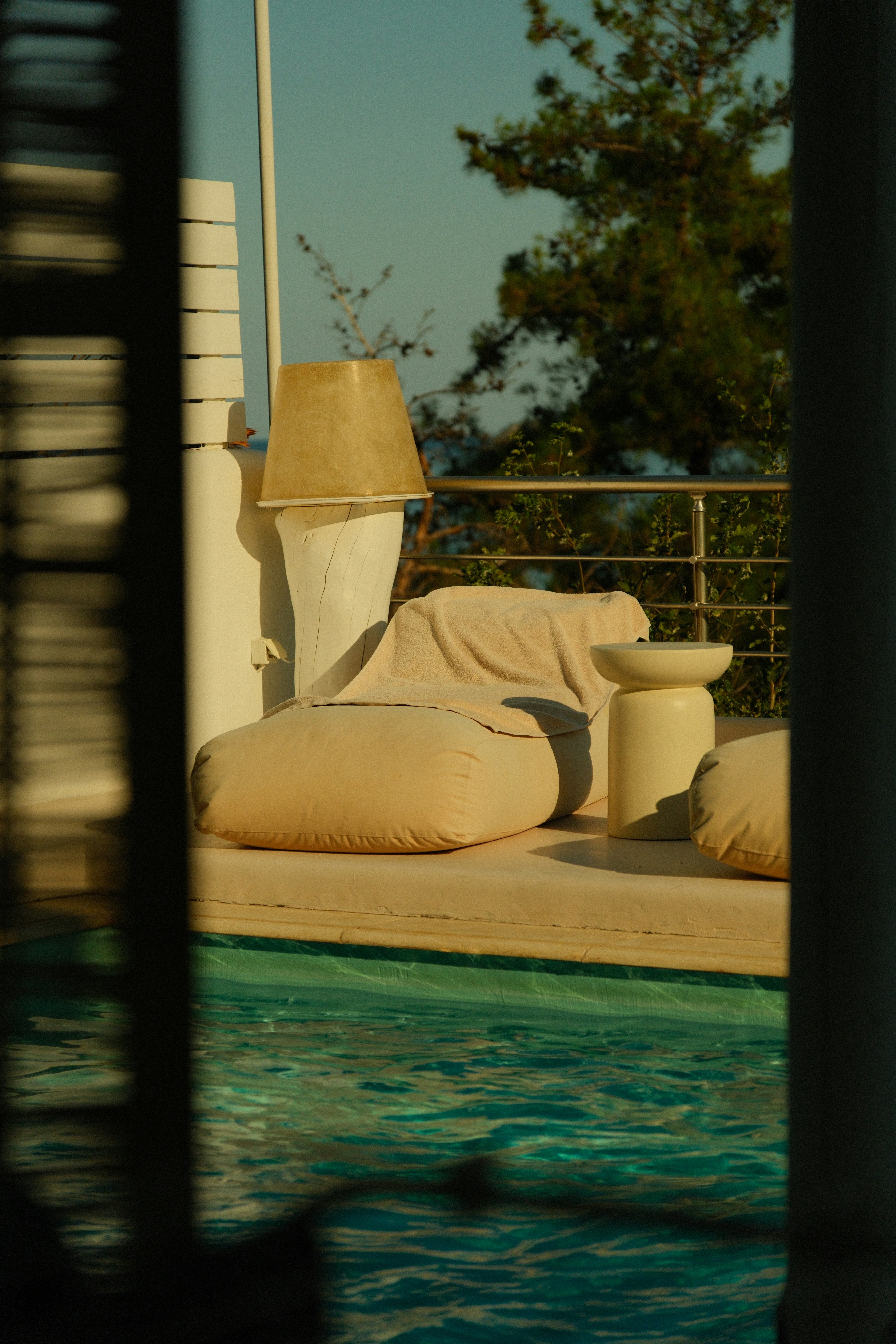 Sunlit Terrace Cushions and Pool Edge at Dusk