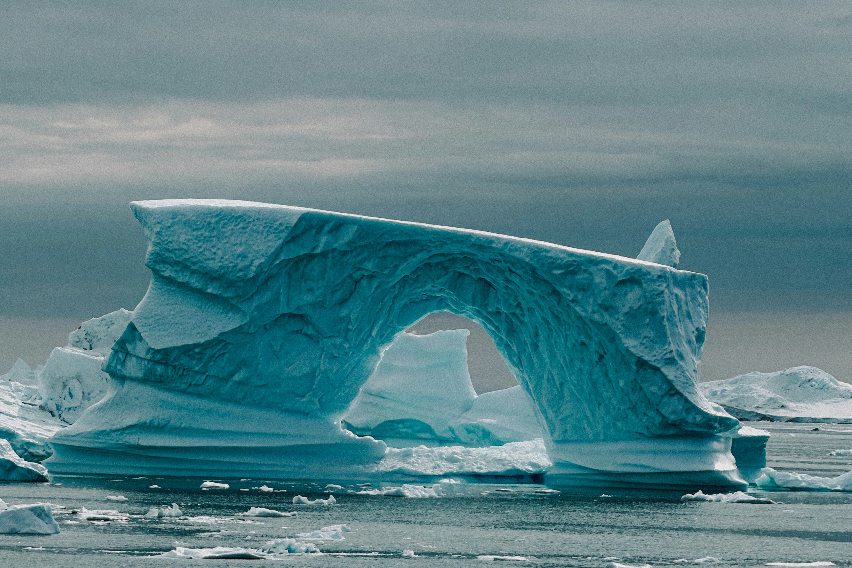 Ice Arch Silence: A Glacial Window Over Arctic Waters