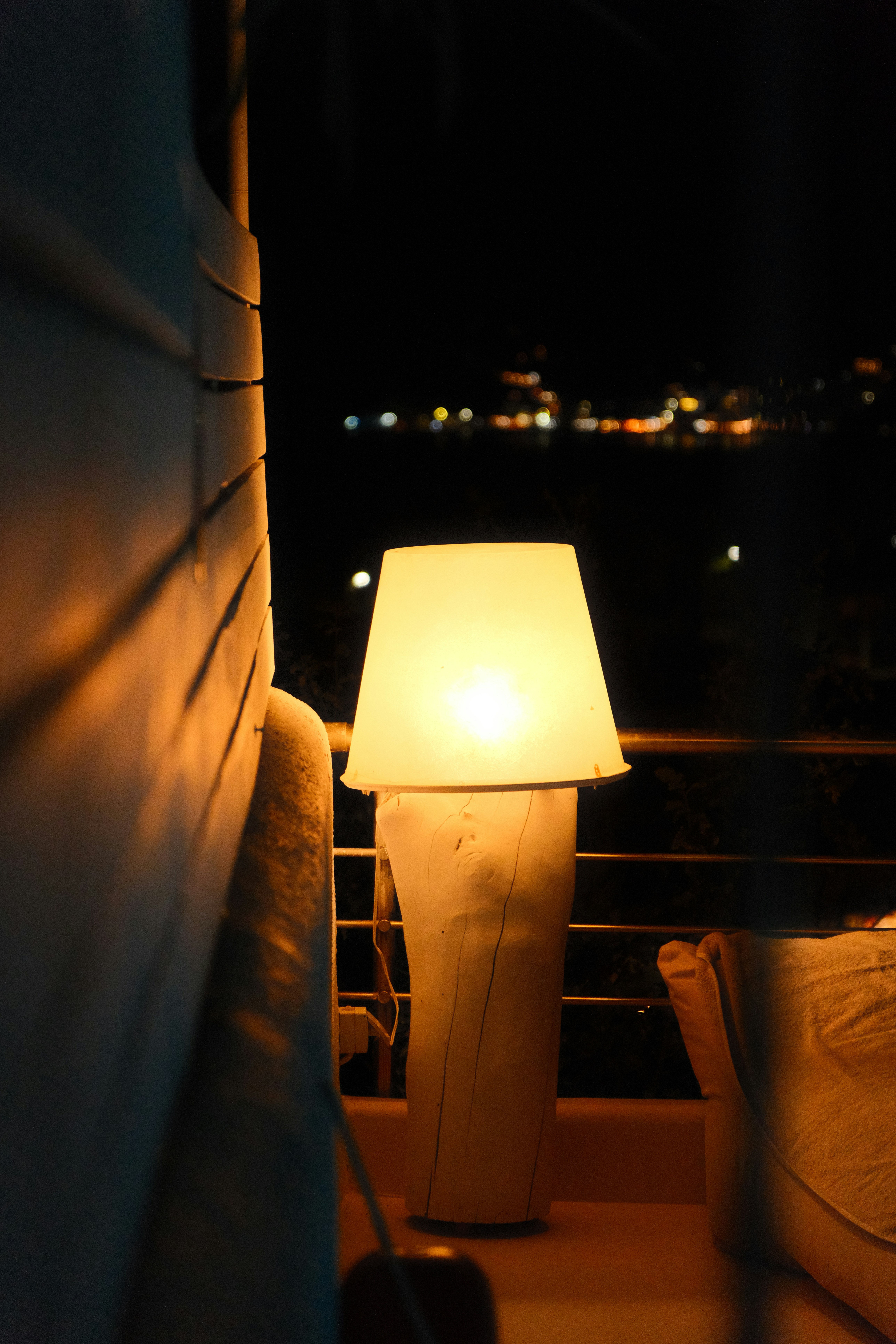Glowing Lantern On a Quiet Balcony at Night