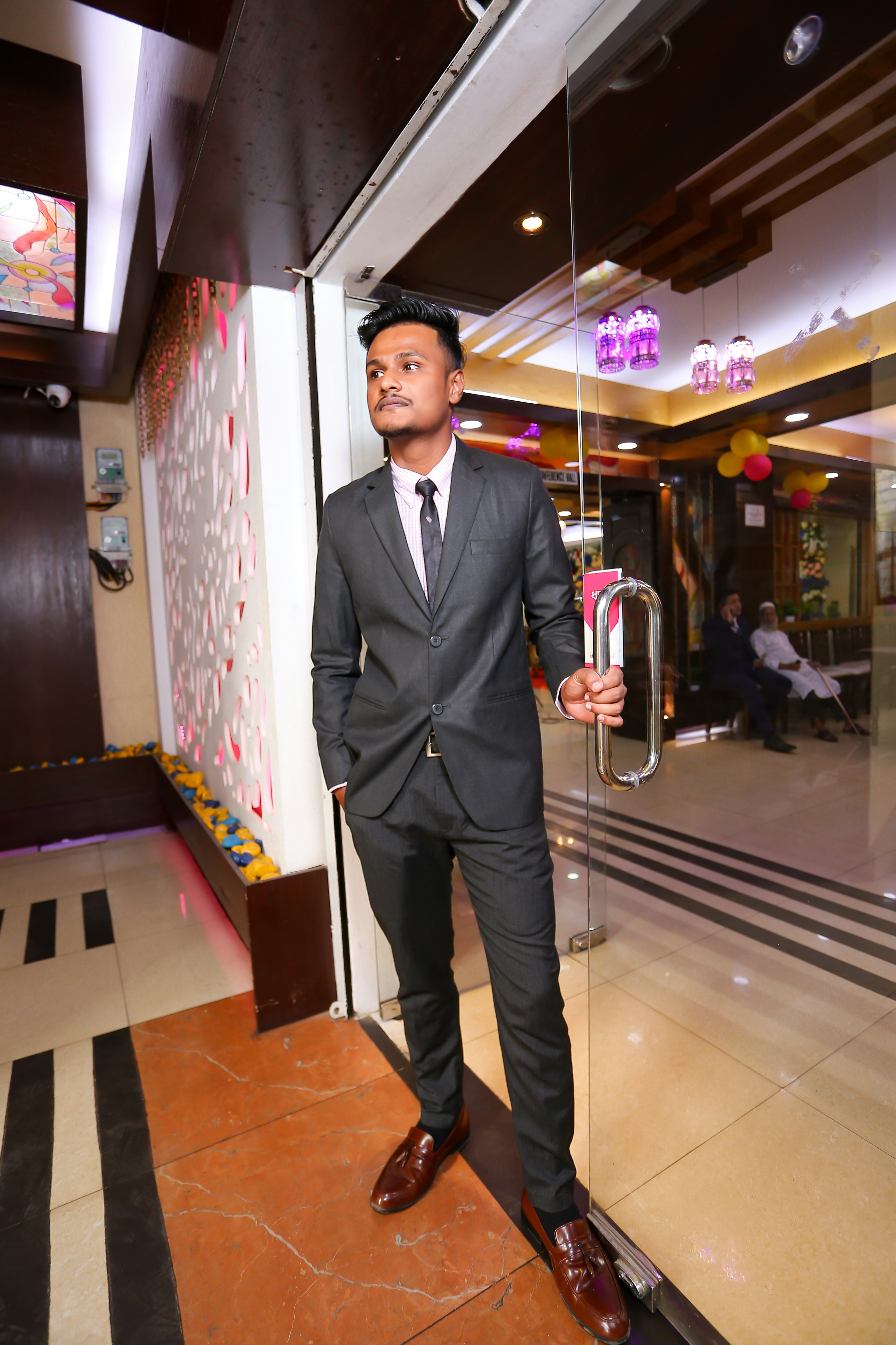 Entrepreneurial Entrance: A Dapper Moment at the Glass Door
