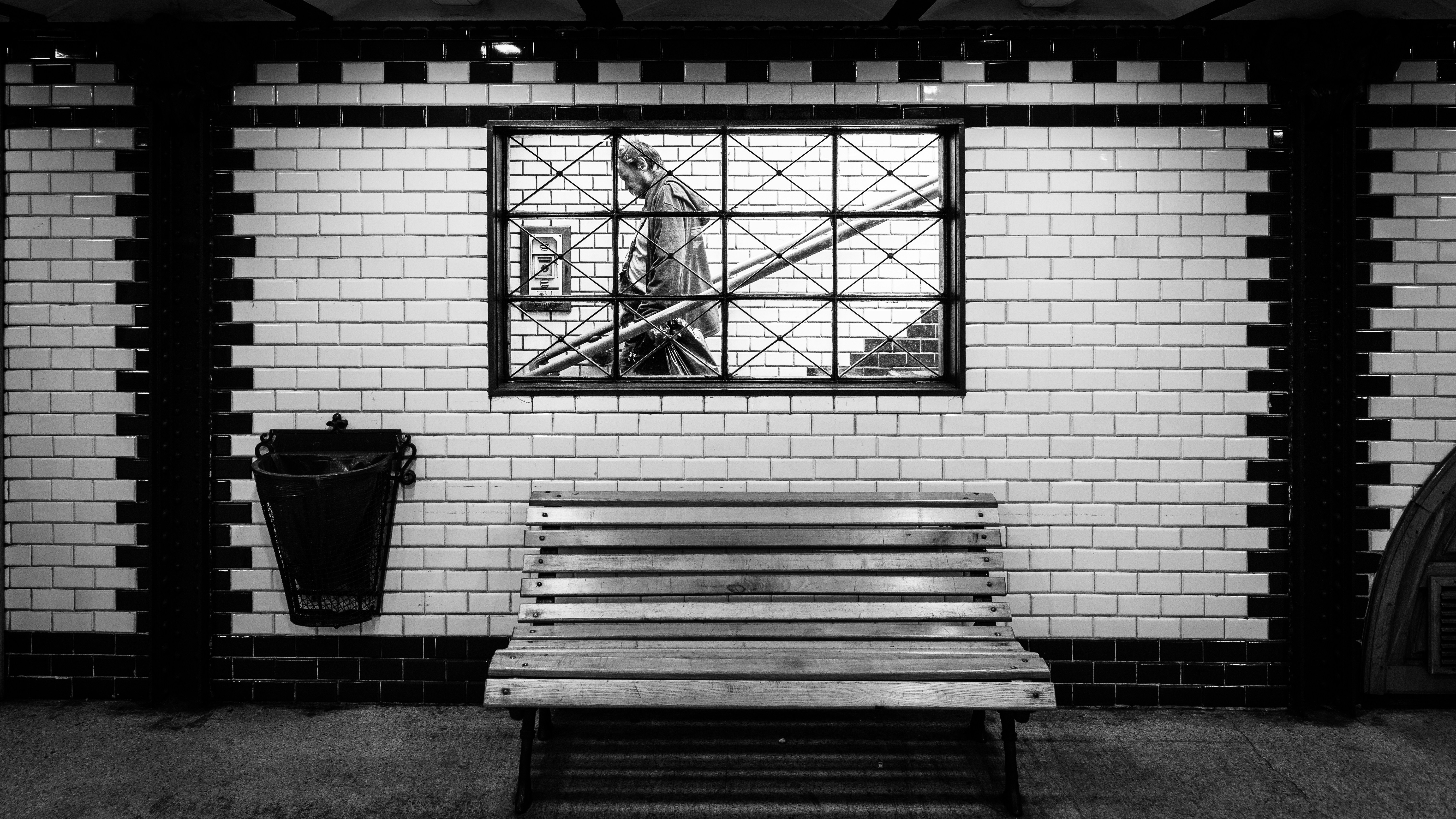 Waiting on the Track: A Quiet Moment Under Subway Lighting