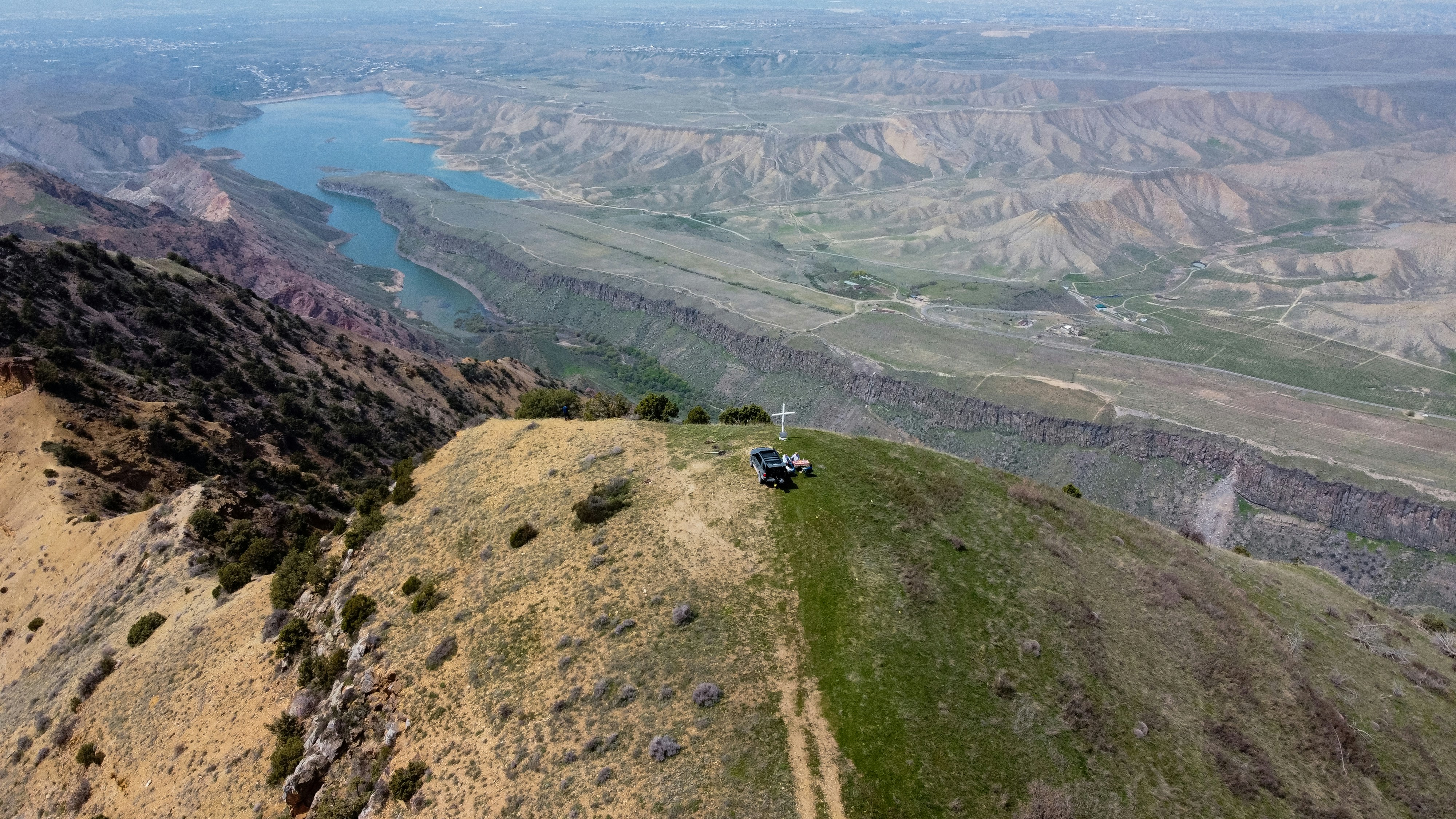 High Desert Summit: Vehicle at the Edge of the Canyon