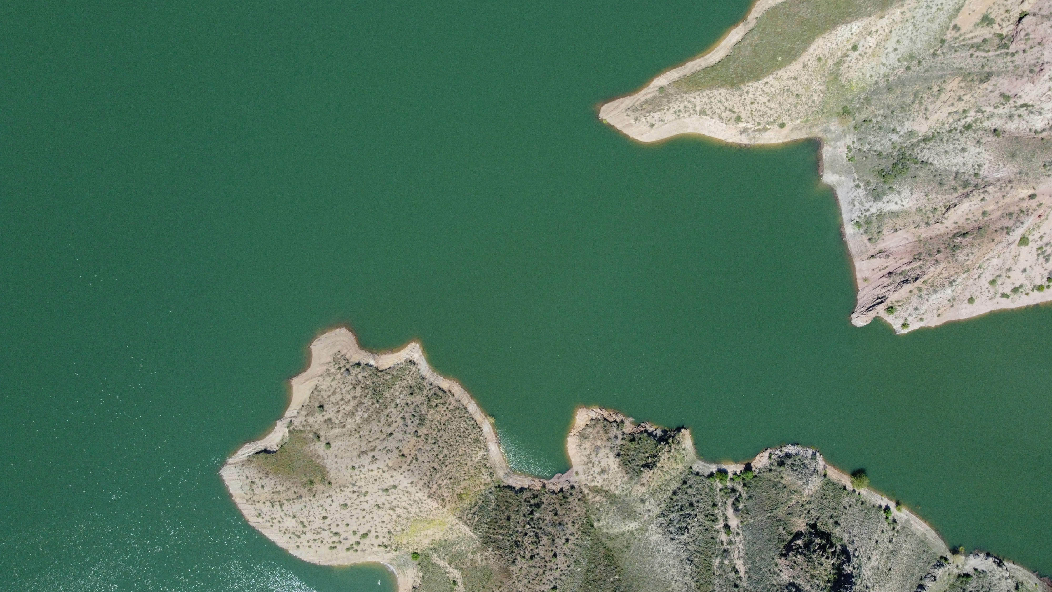 Limestone Promontories Adrift in Quiet Green Water