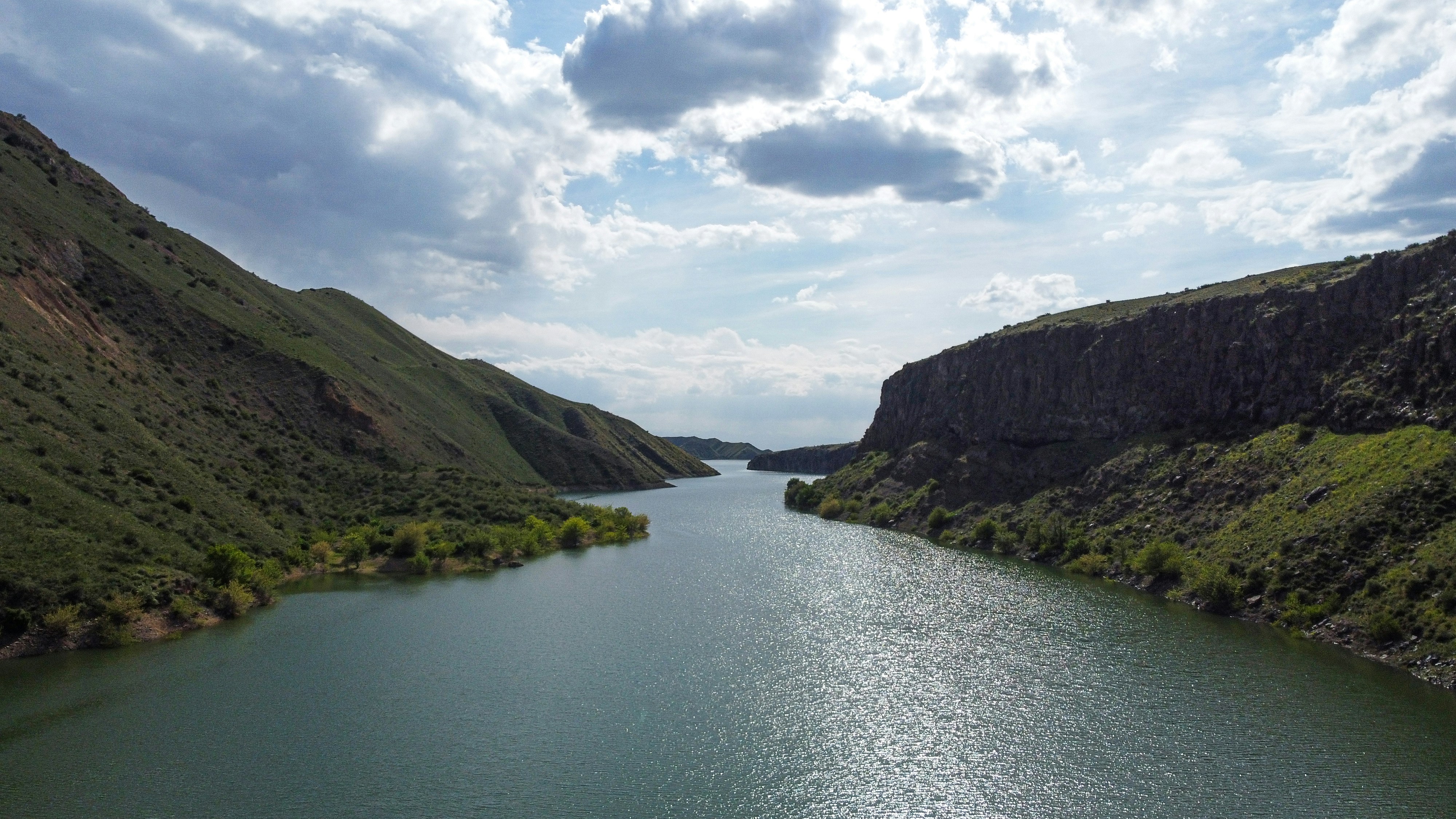 Vast River Gorge Between Green Folds