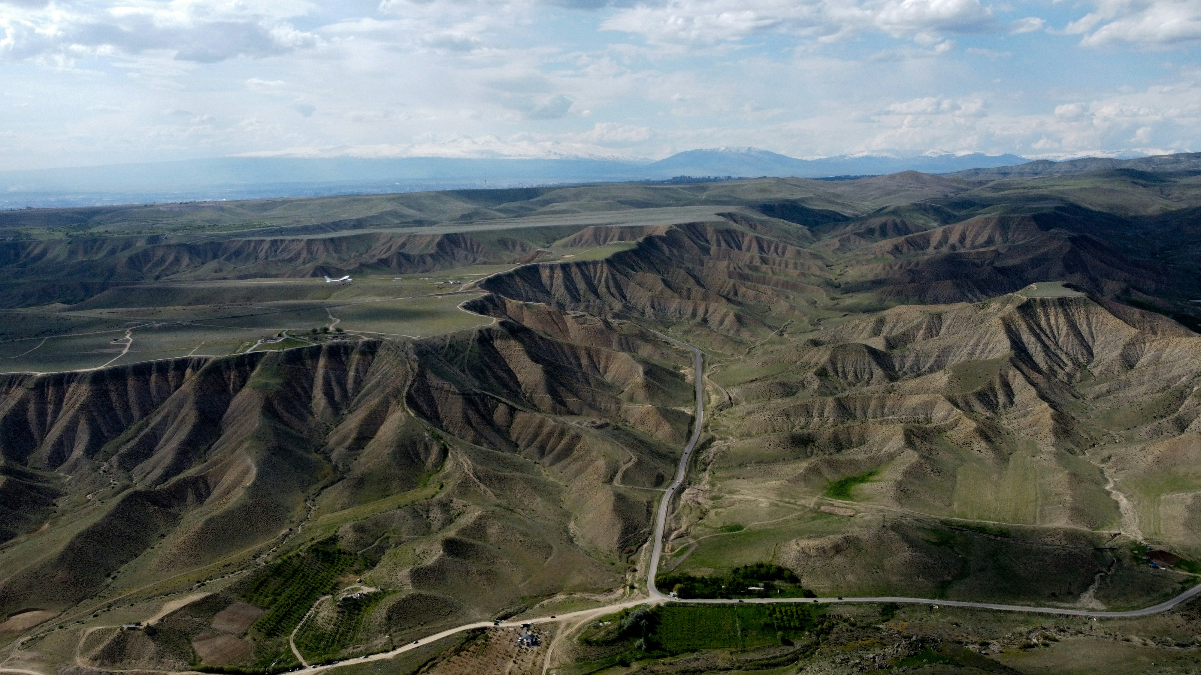 Rugged Basins Unfold Along a Vein of Roads