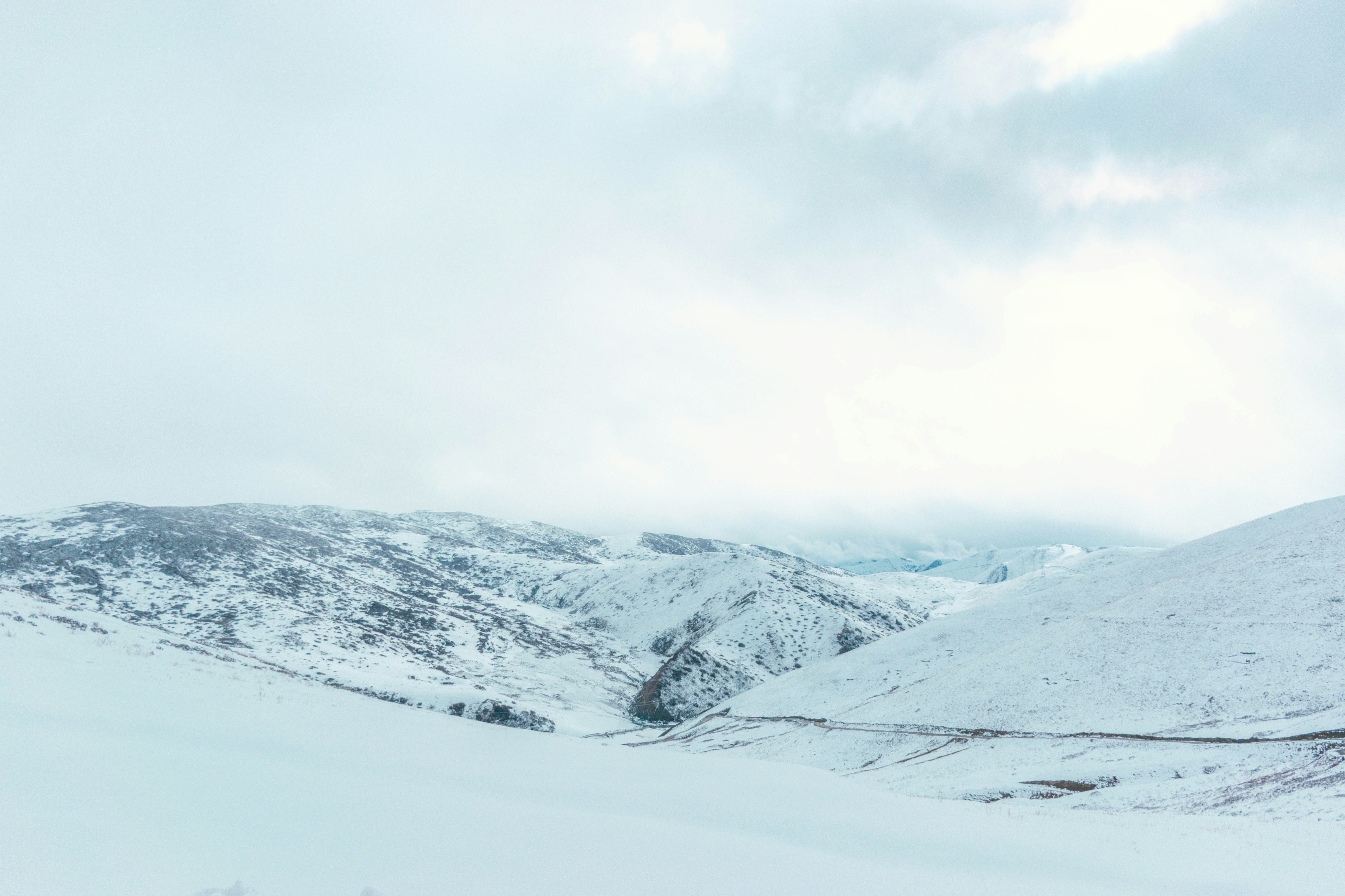 Valley Fold: Snow-Covered Hills Under Soft Overcast Light