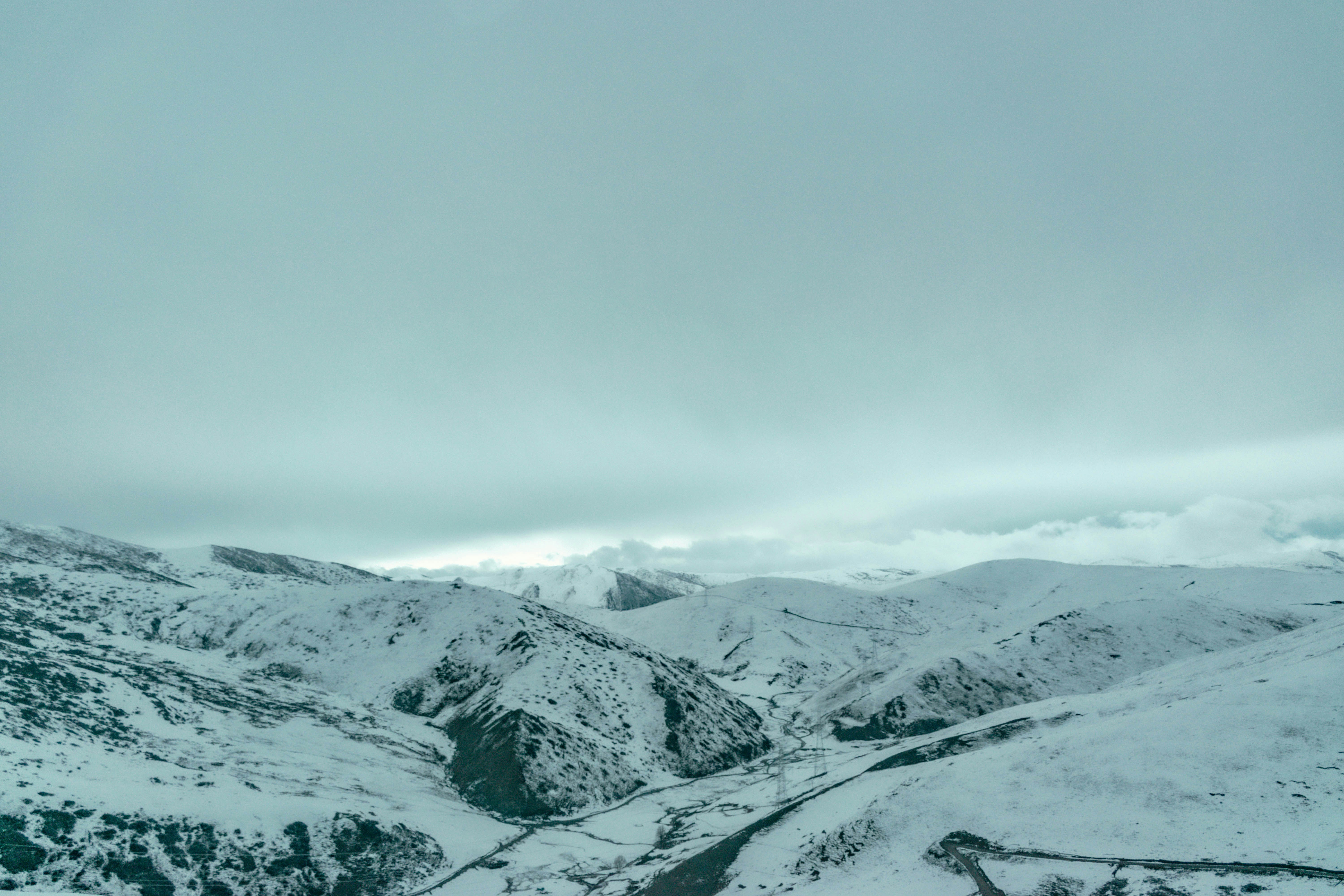  twilight ridge: snow-veiled peaks under a cool sky