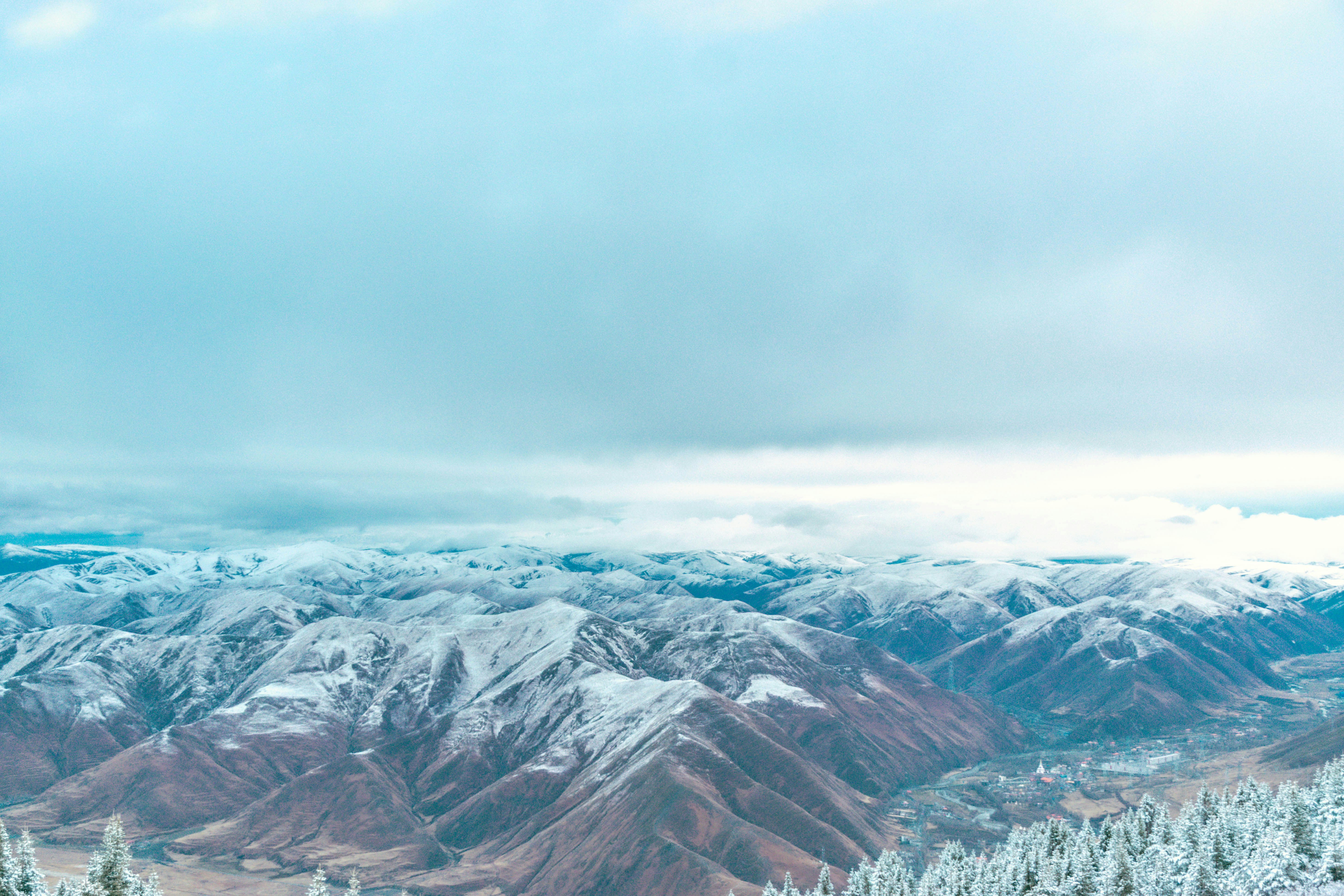 Snow-Capped Ridge Under Wide Sky