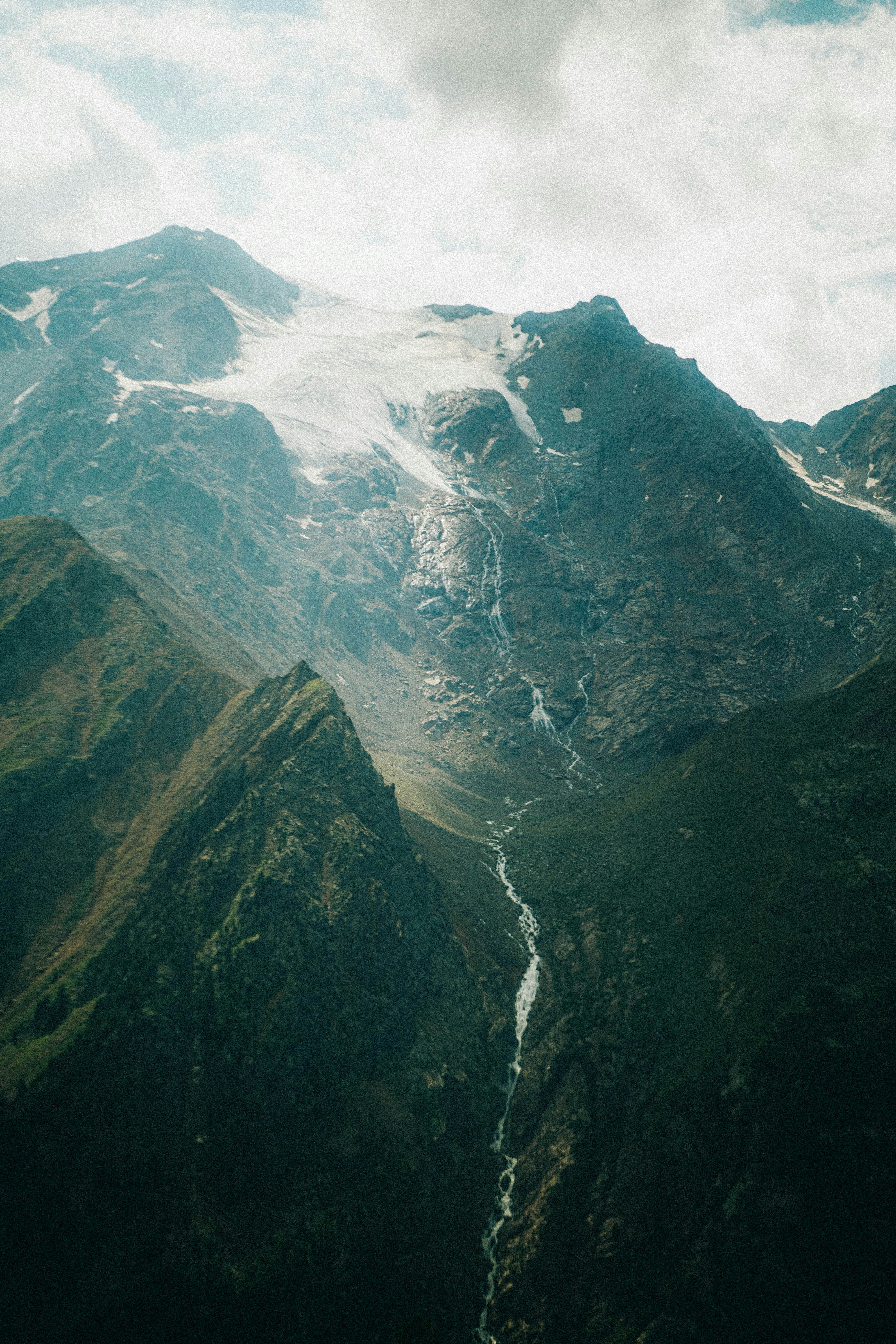 Glacial Vein: A Mountain Crest Carved by Snow and Stream