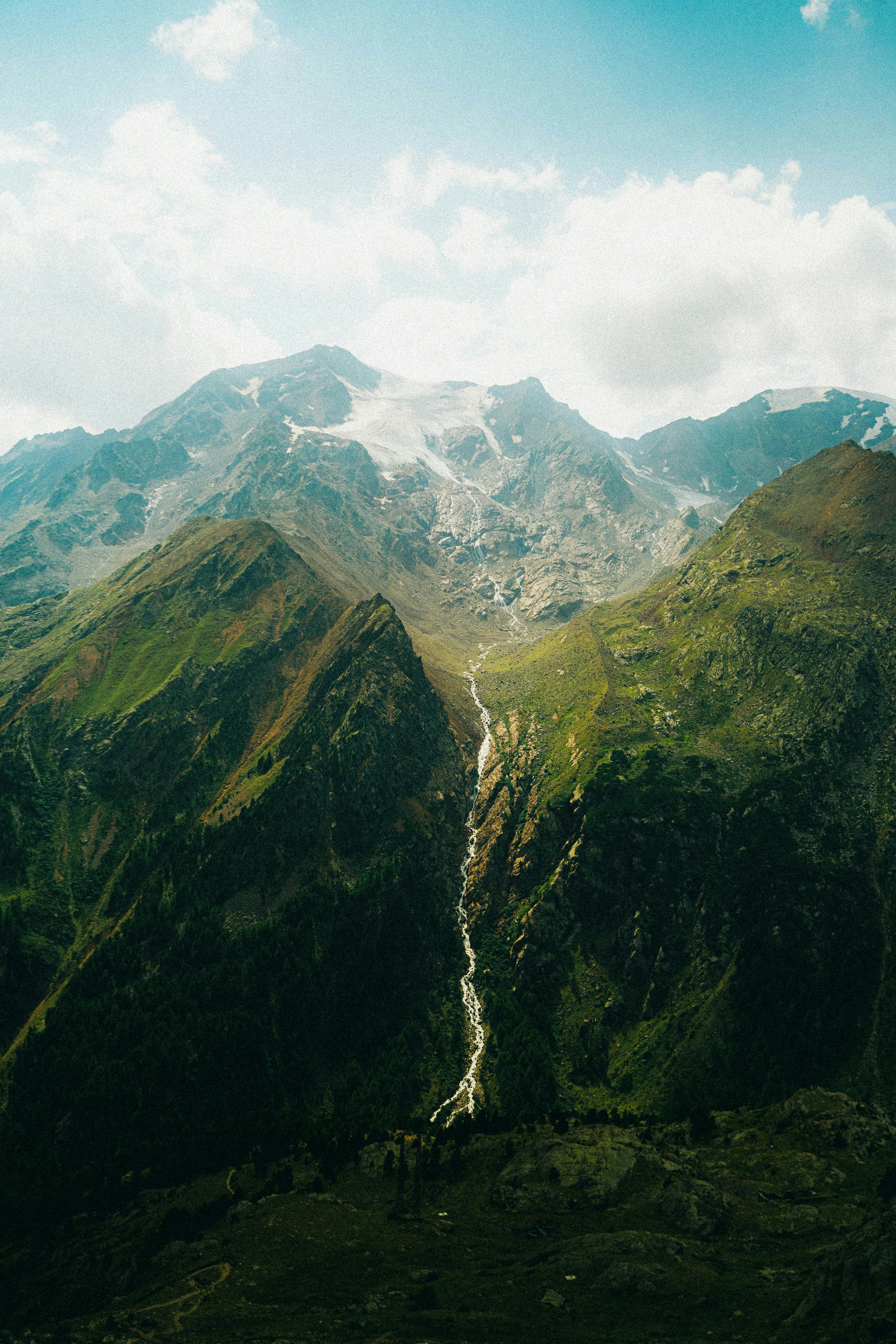 A Slim Vein of Snow Descends the Mountain Spine