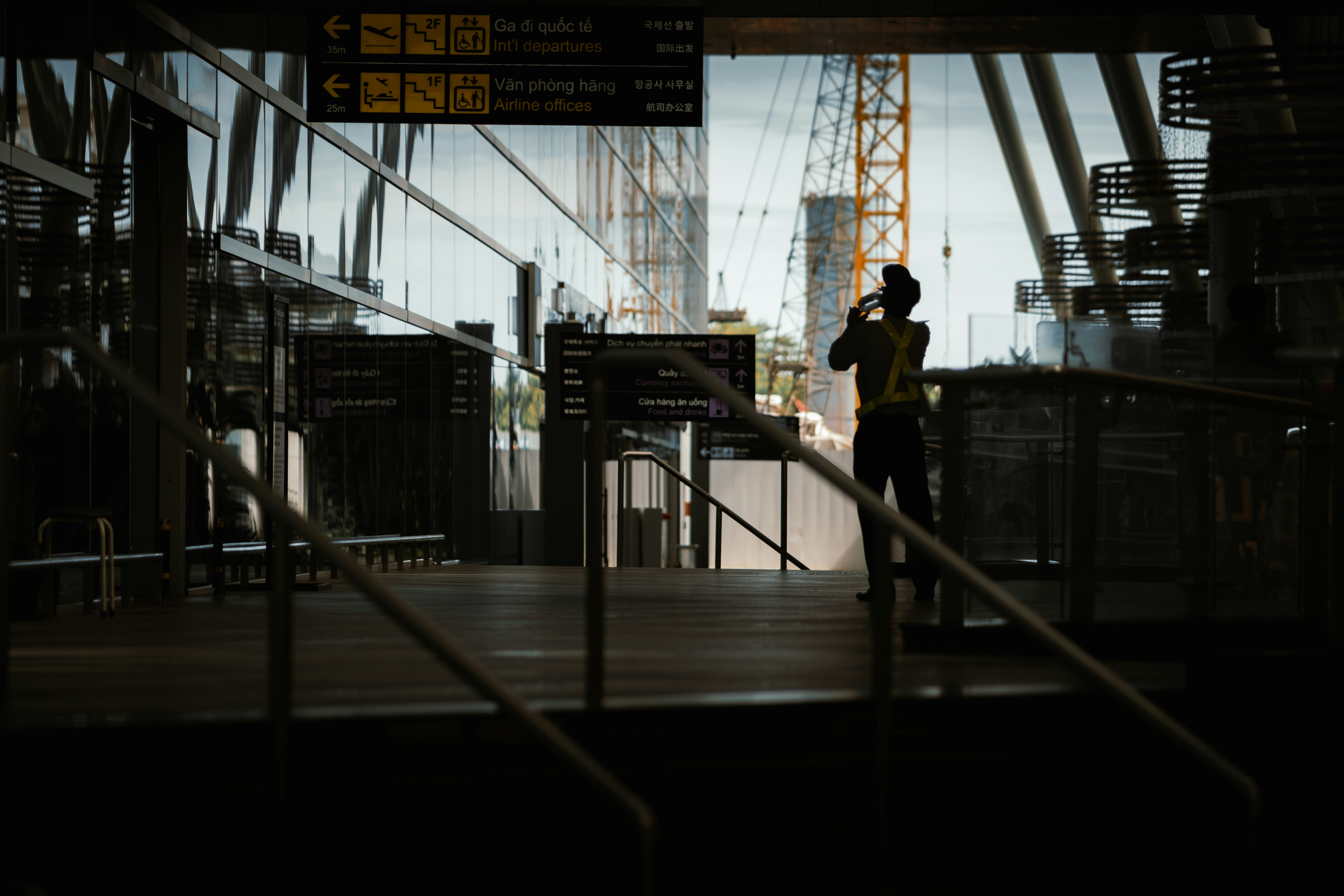 Shadowed Terminal: A Photographer in the Quiet Between Beams