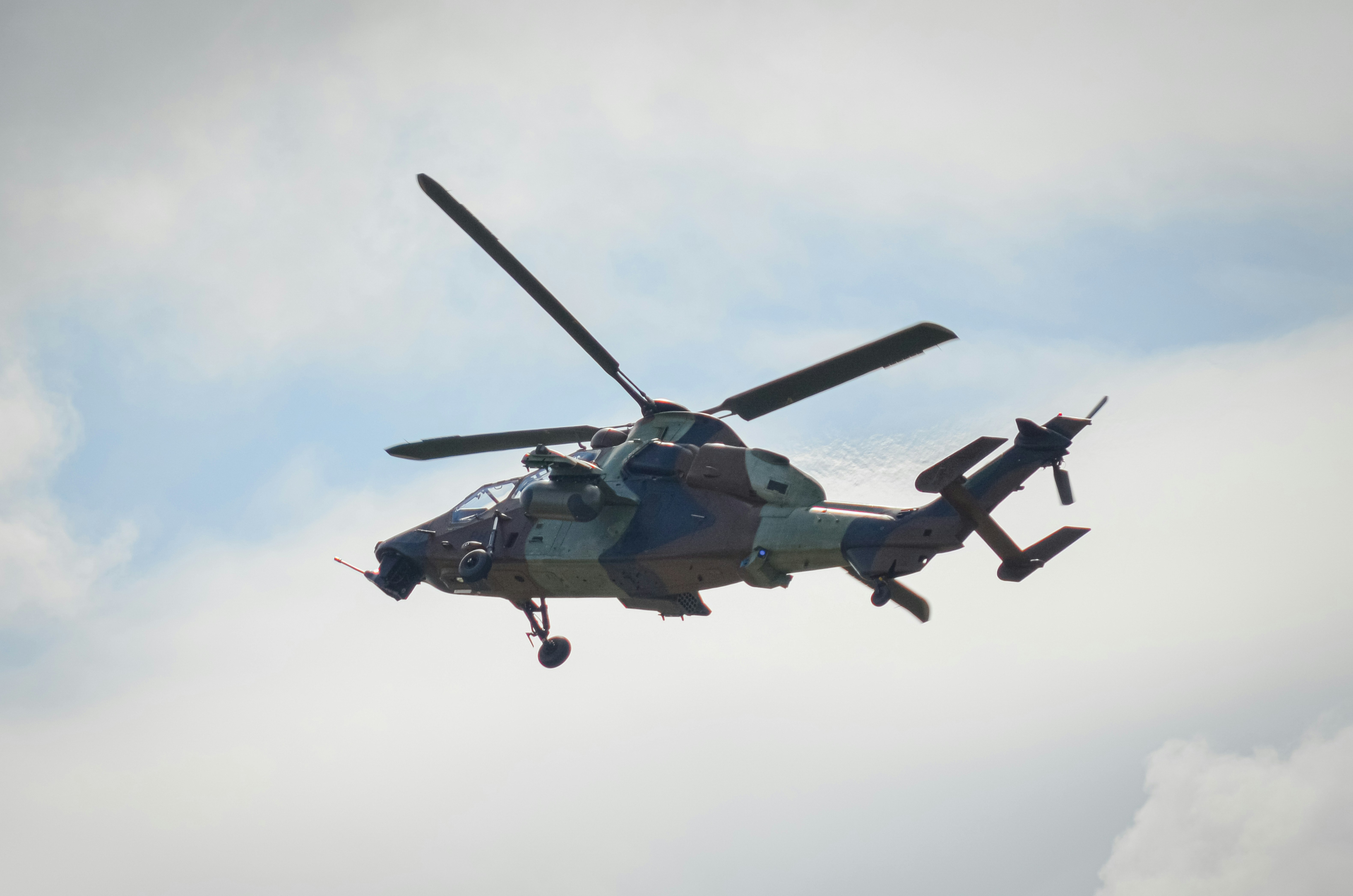 Chinook in Flight: Dual-rotor silhouette against a drifting sky