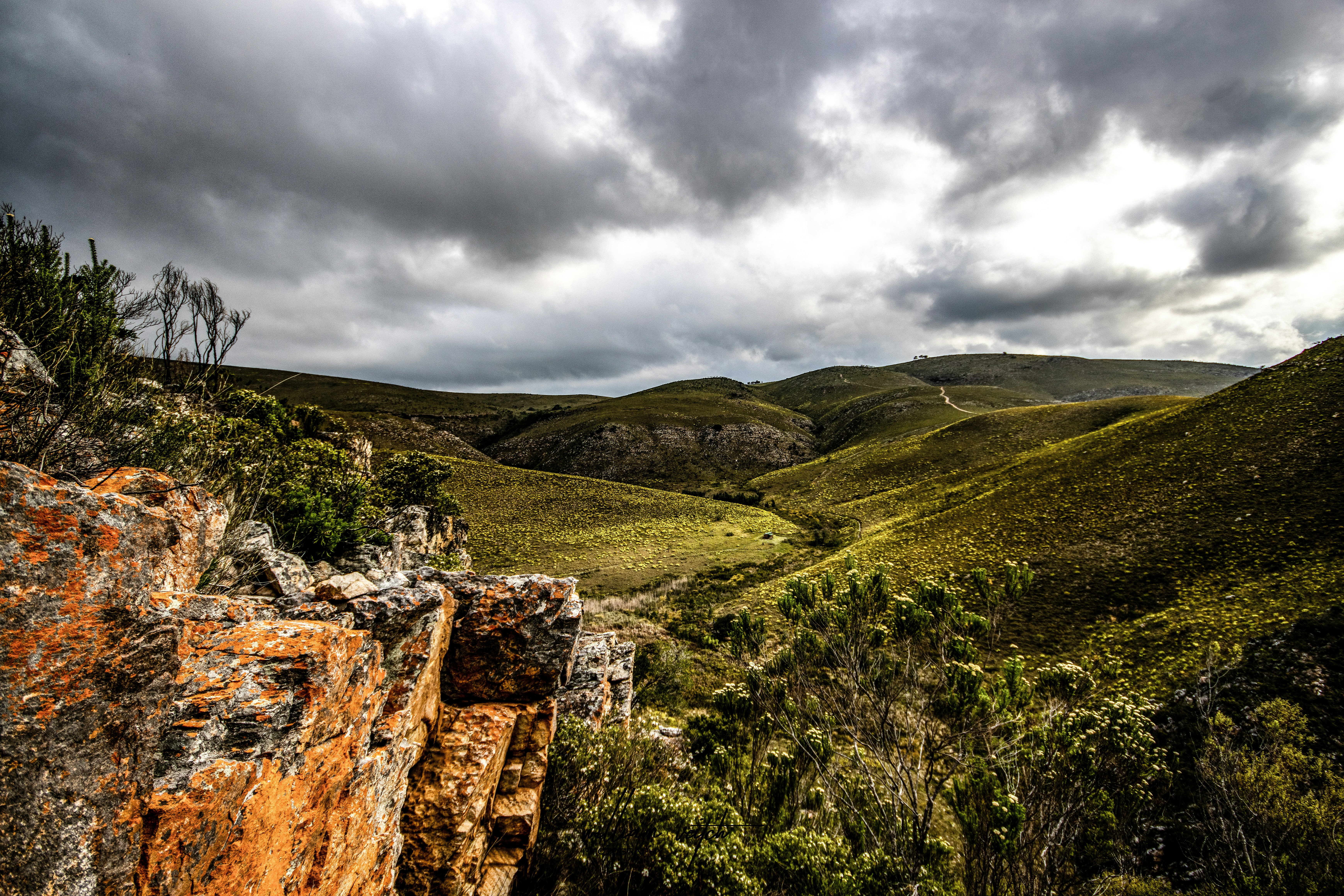Storm-Rowed Hills: A Stone Ridge Overlooking a Wind-Worn Valley