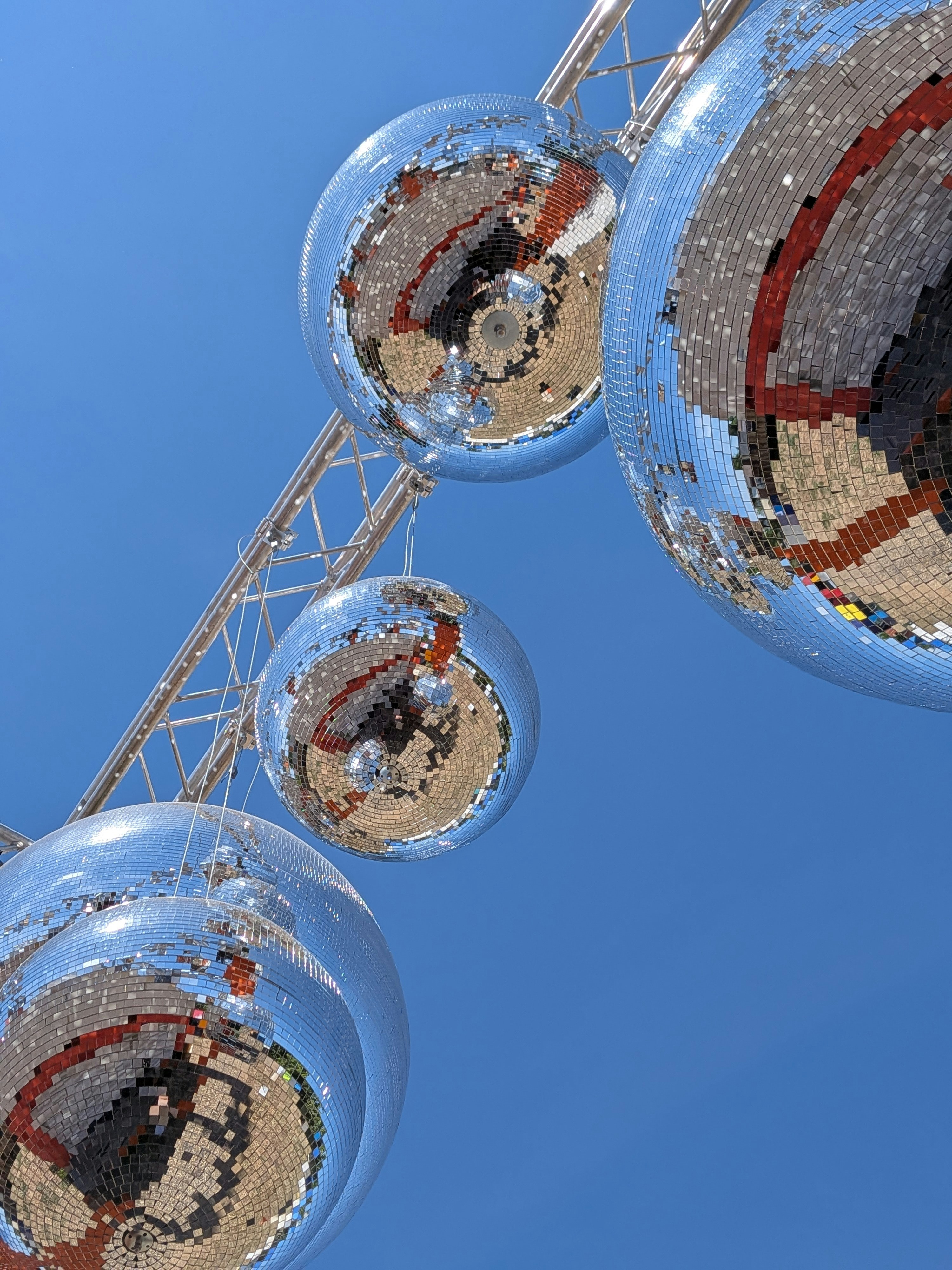 Mirror Metropolis: Disk Reflections on a Clear Blue Day