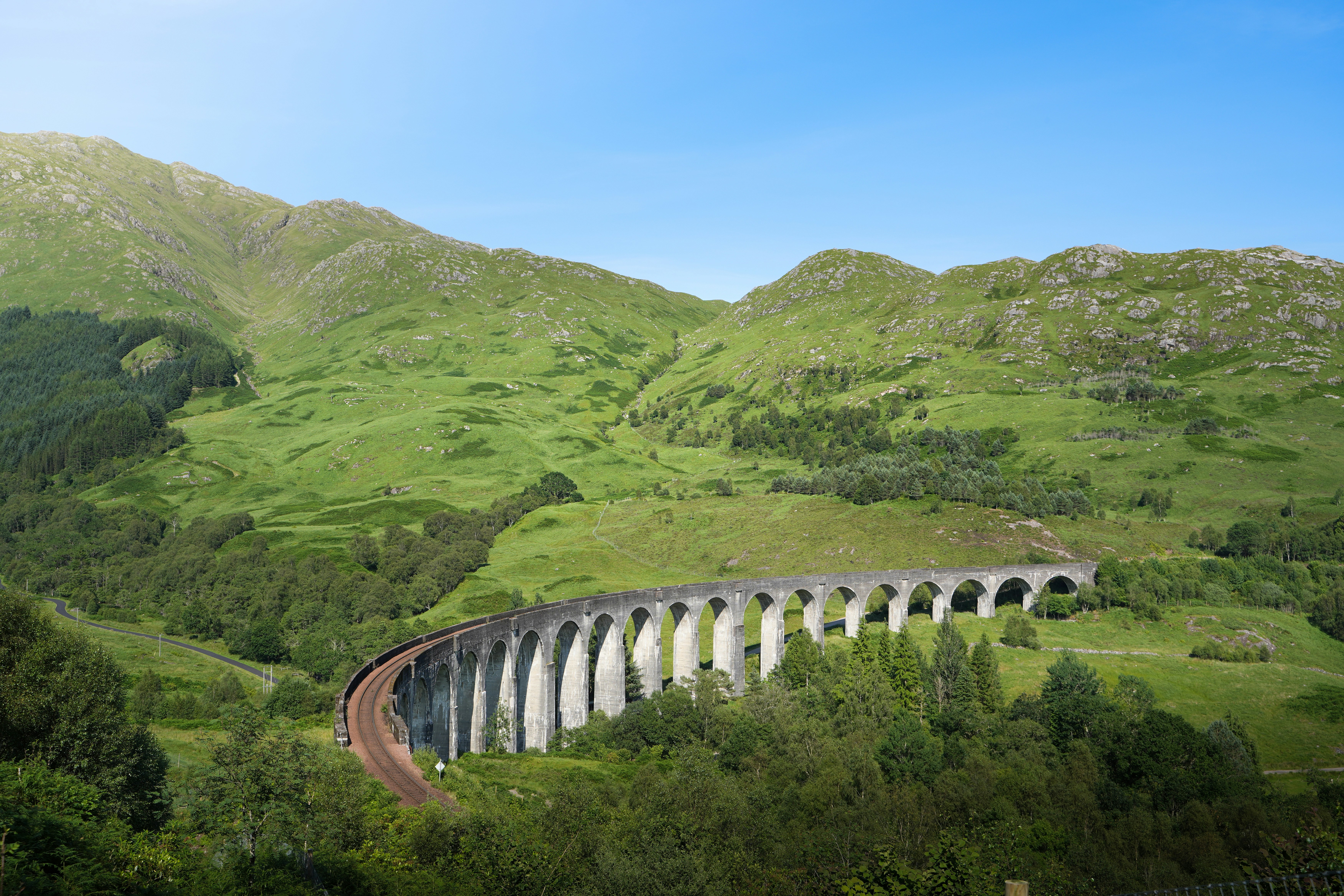 Steel Arch Through Emerald Hills