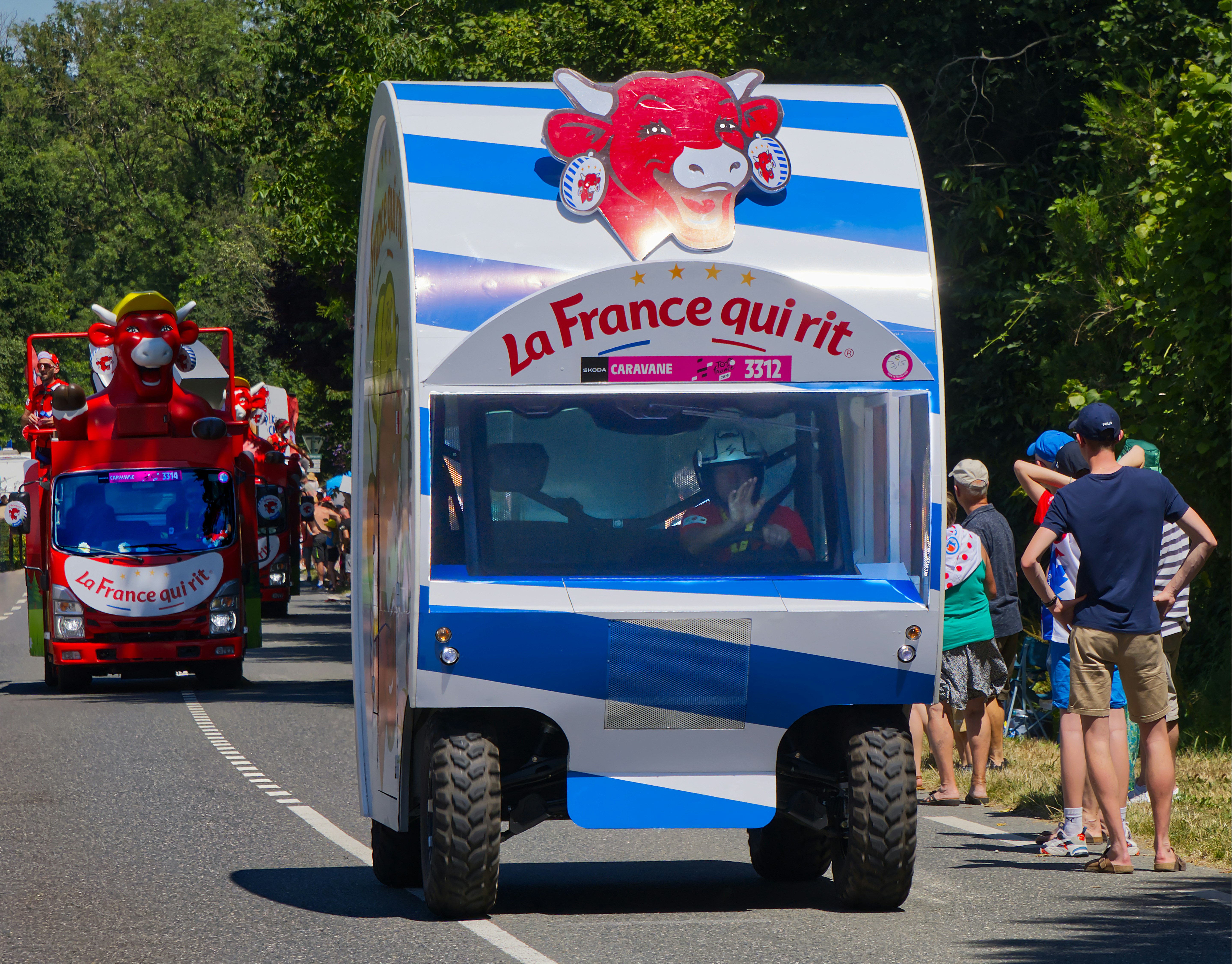 Parade Peel: Blue Cadet Truck Leads a Colorful Festival Constellation