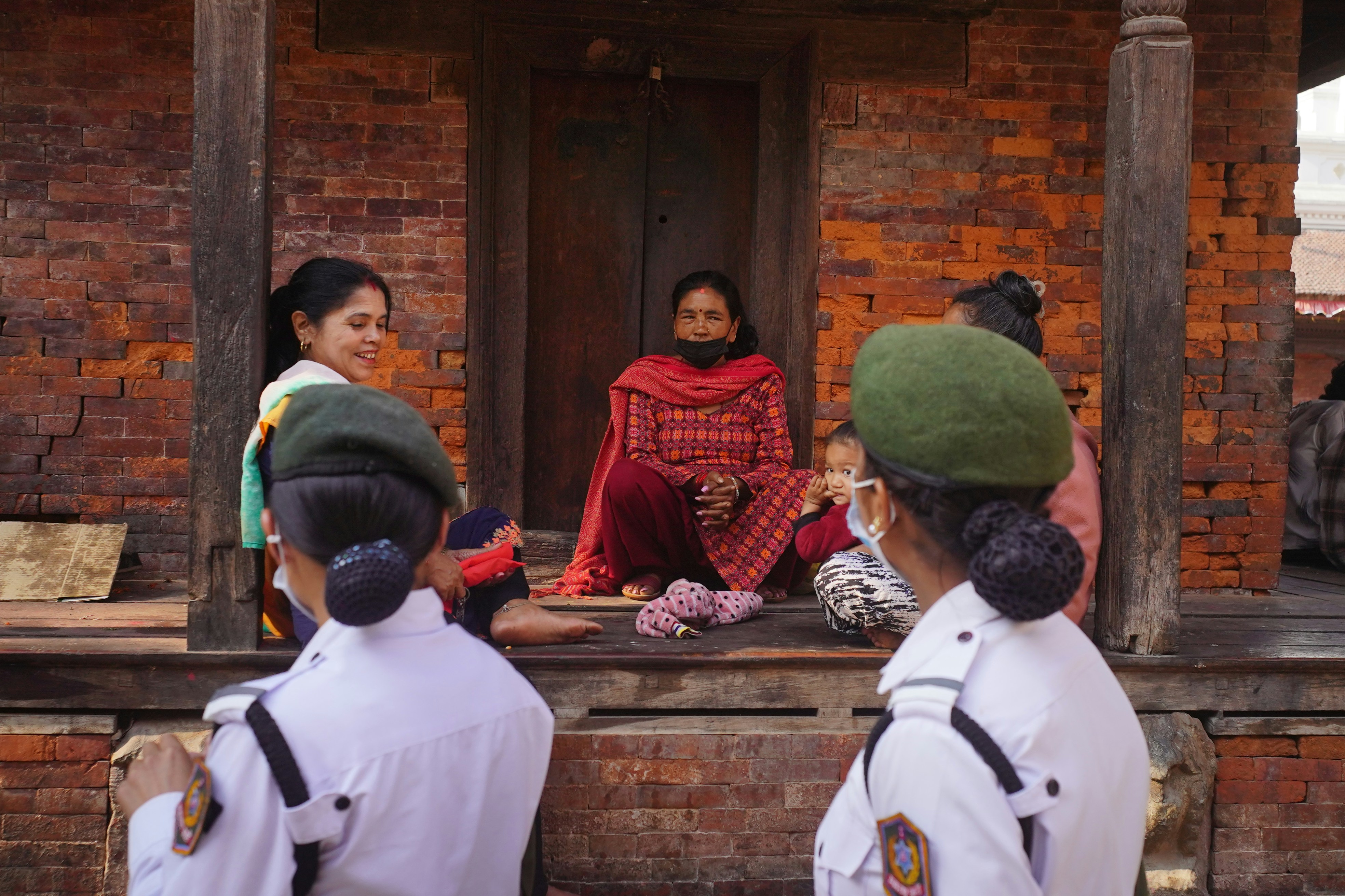 Conversations on the Brick Terrace: Policemen Guard a Quiet Moment