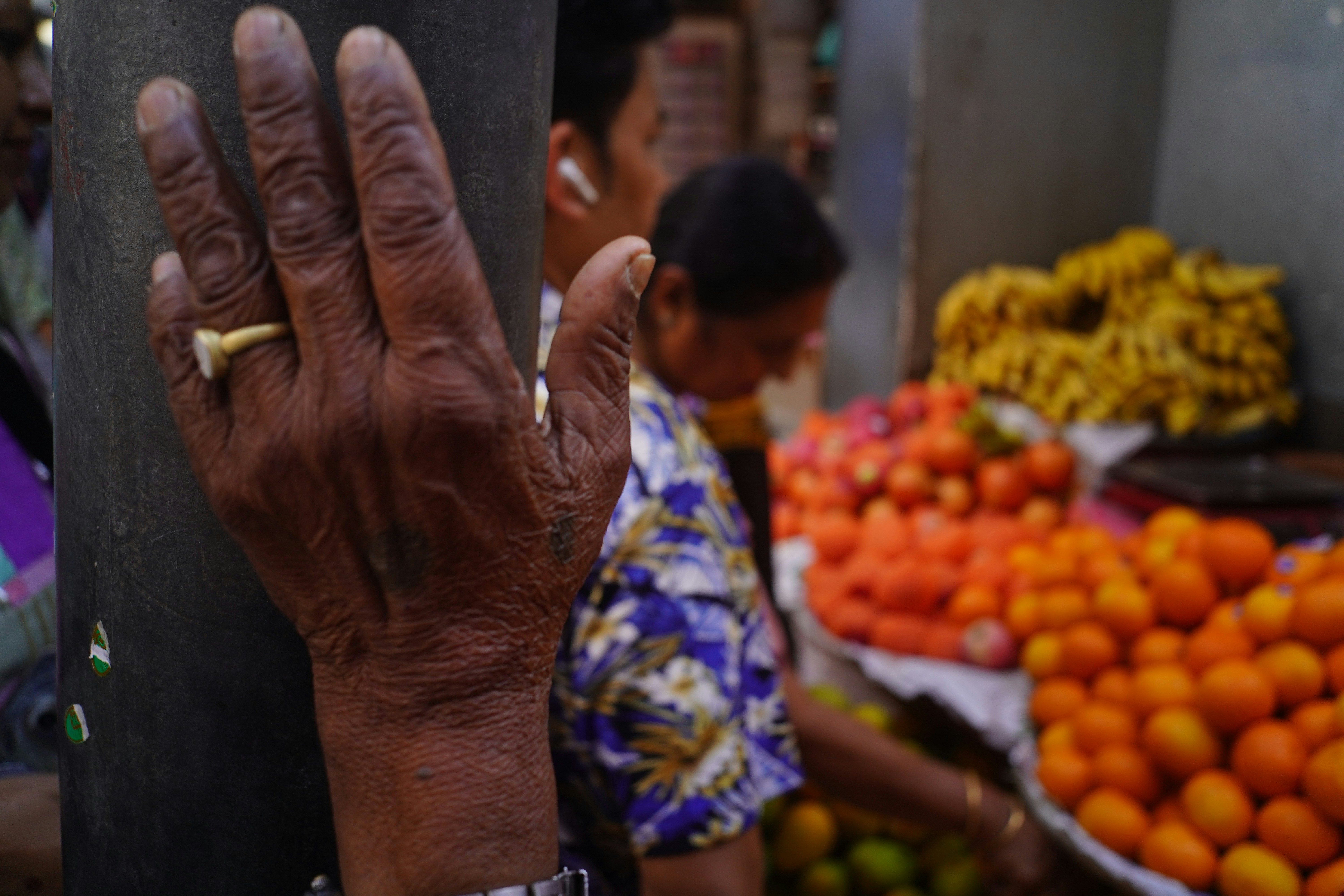 Hand, Pole, and Market Colors: A Portrait in Motion